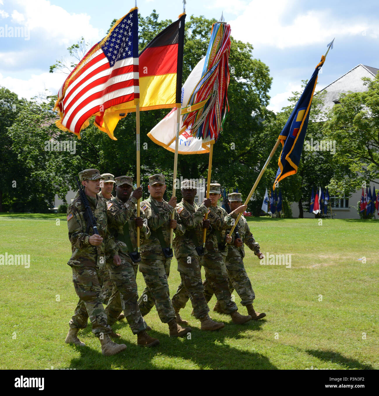 The 7th Mission Support Command color guard marches during the pass in ...