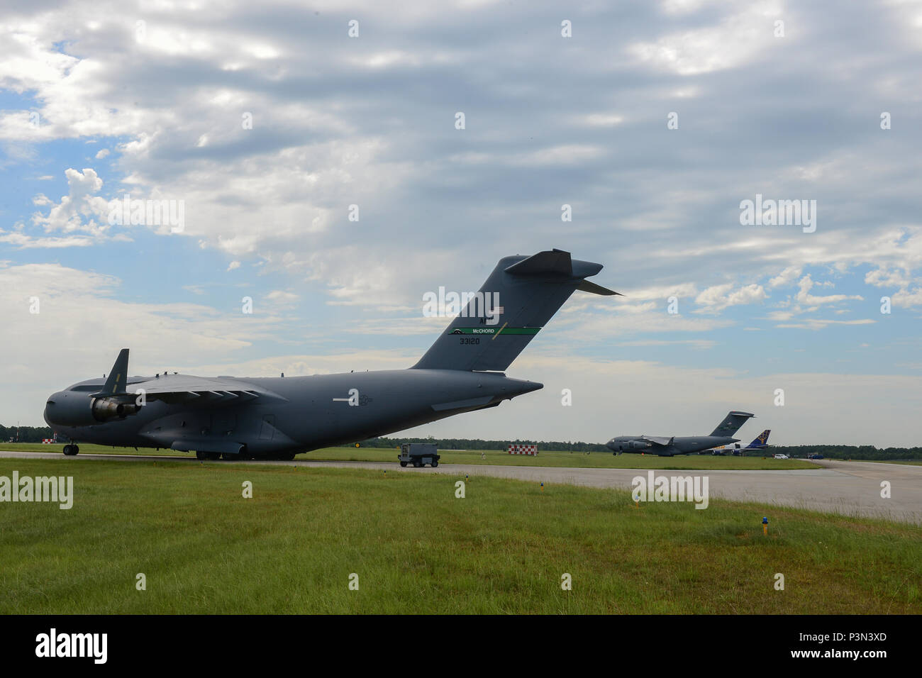 Two C-17 Globemaster III transport aircraft and a Boeing 747 transport ...