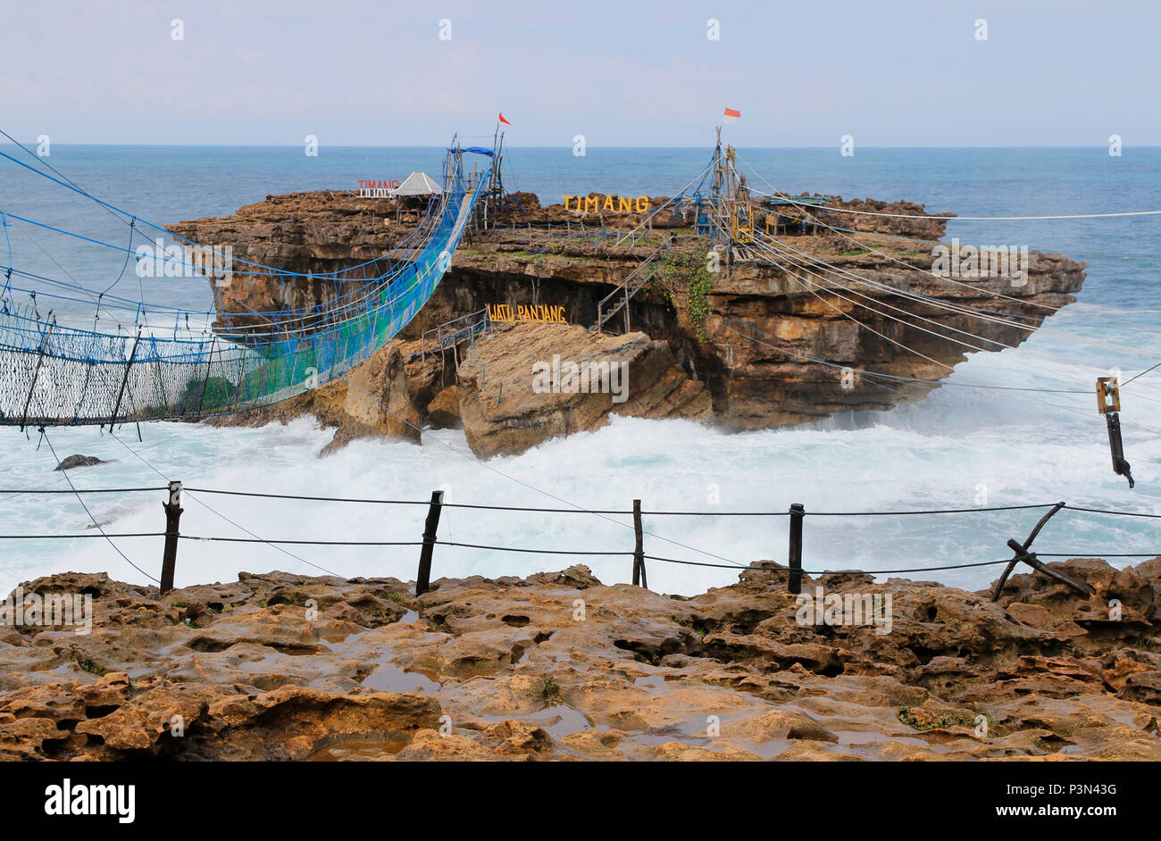 Suspension bridge connecting to the Timang Beach in sunny day ...