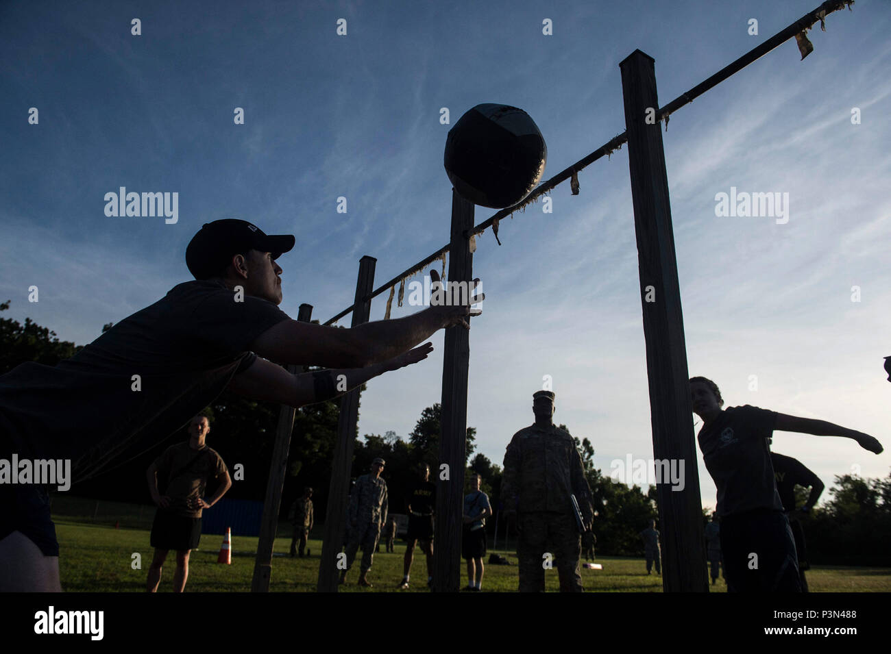 (Left) U.S. Air Force Staff Sgt. Sam Weaver reaches out to catch a ...
