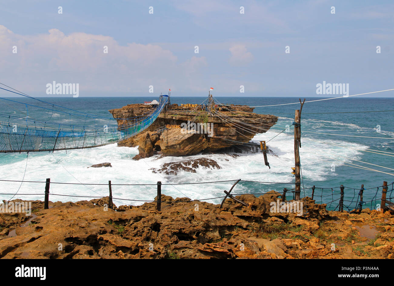 Suspension bridge connecting to the Timang Beach in sunny day ...