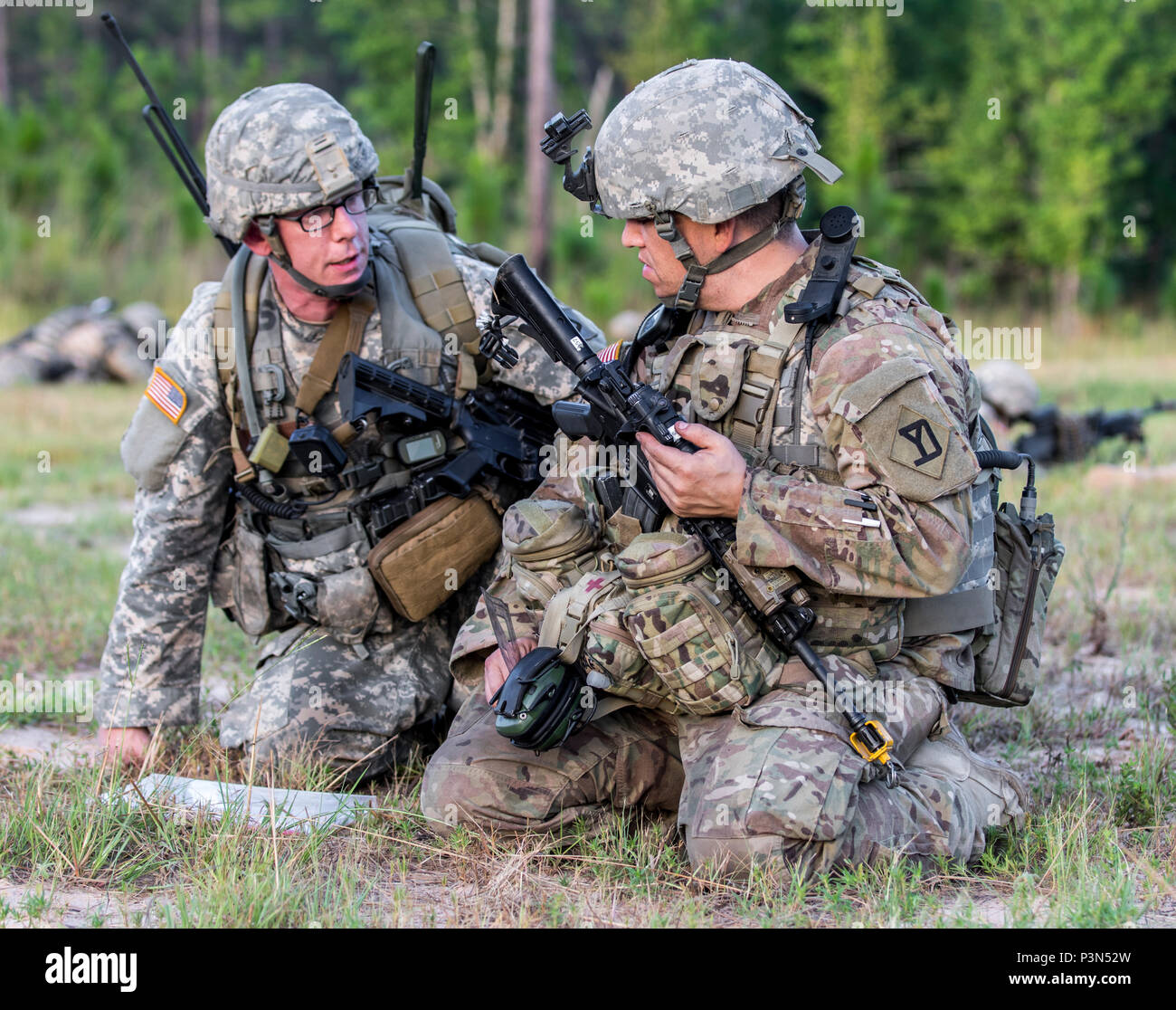 Massachusetts Army National Guard Staff Sgt. Alex Vath (right) and 1st ...