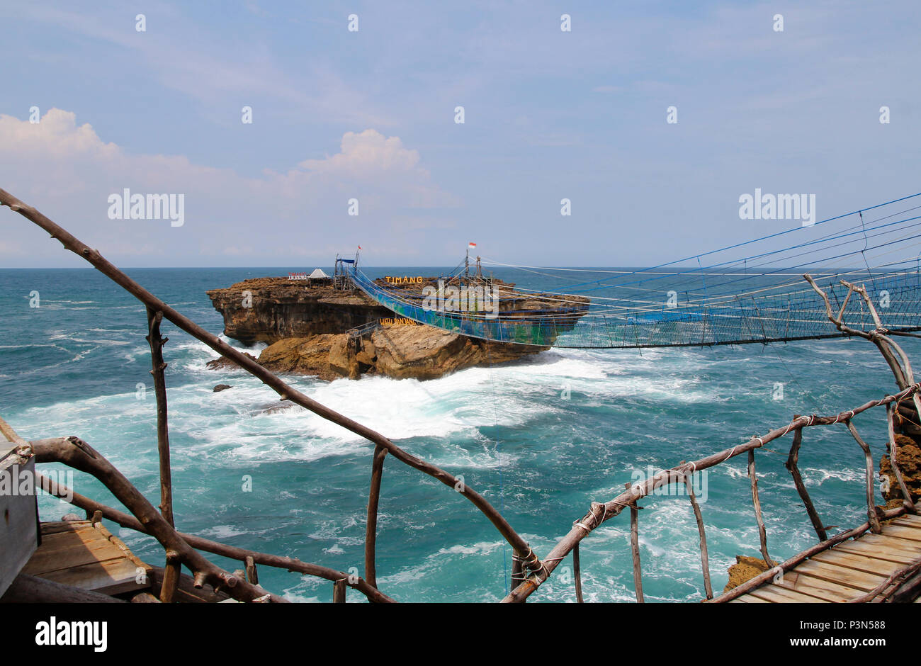 Suspension bridge connecting to the Timang Beach in sunny day ...