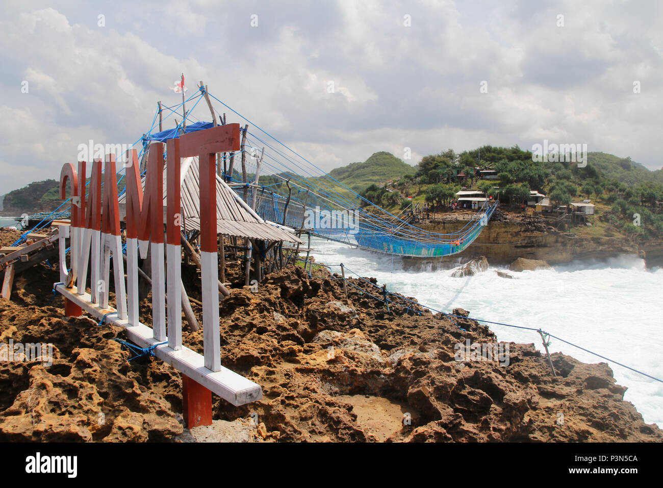 Suspension bridge connecting to the Timang Beach in sunny day ...