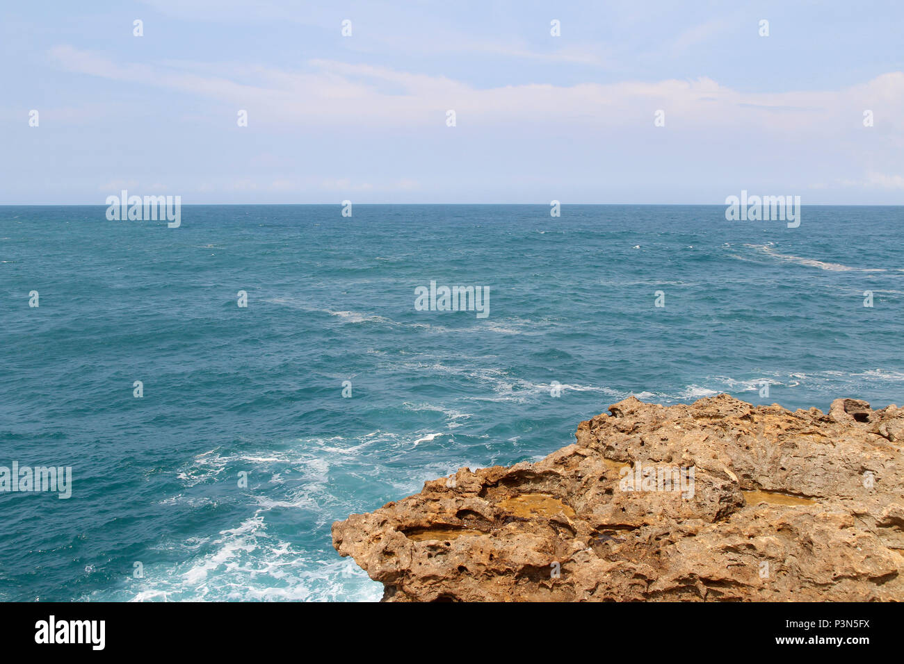 Natural rock formation with the wave at Timang Beach in sunny day ...