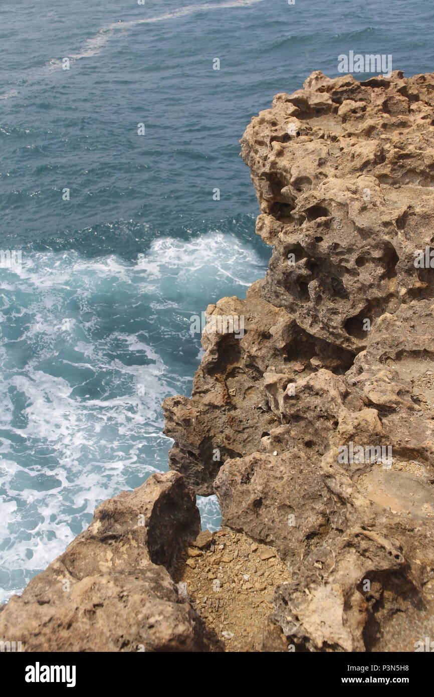 Close-up of natural rock formation with the wave at Timang Beach in ...