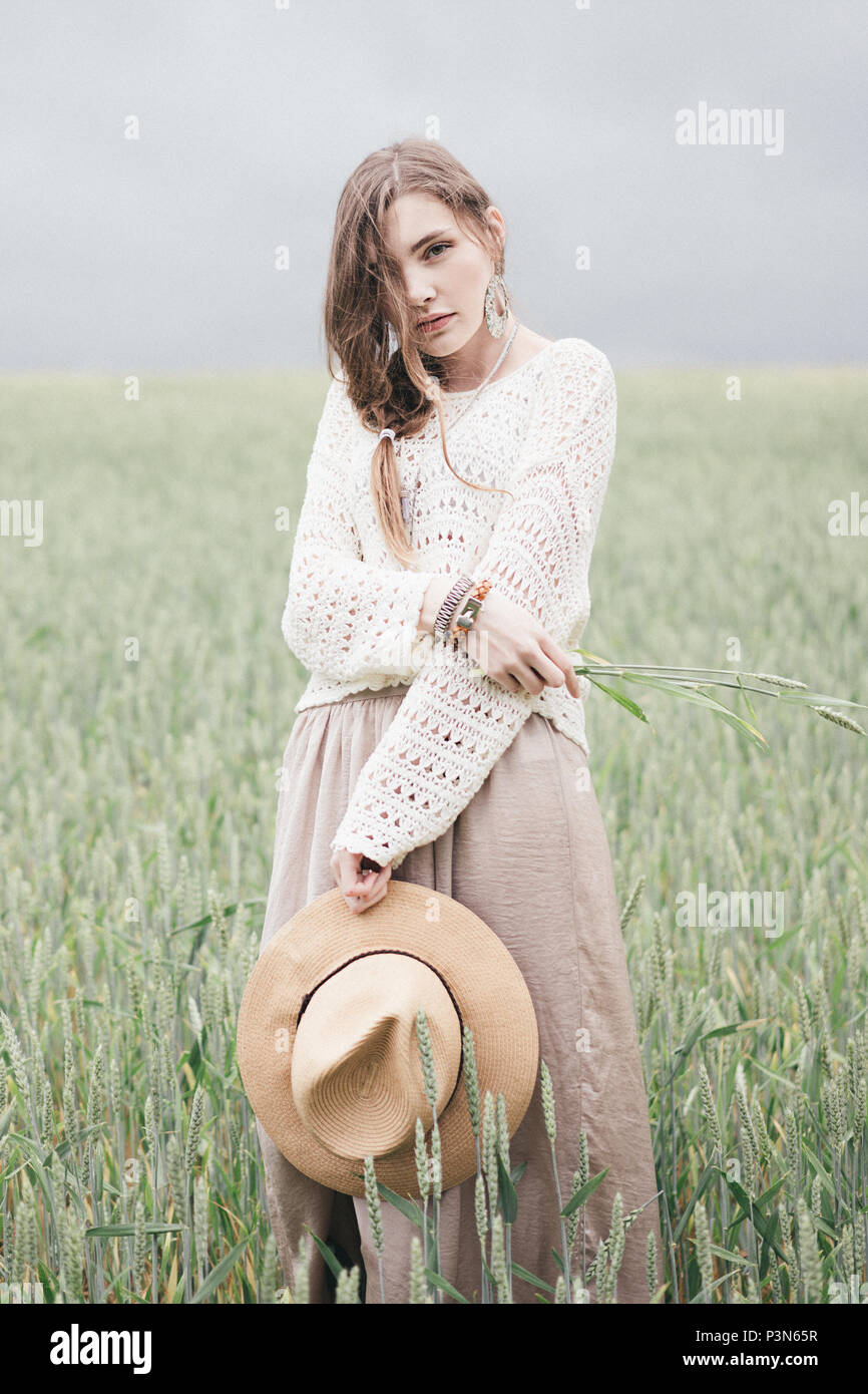Girl in eco style clothes posing in nature background. Portrait of ...