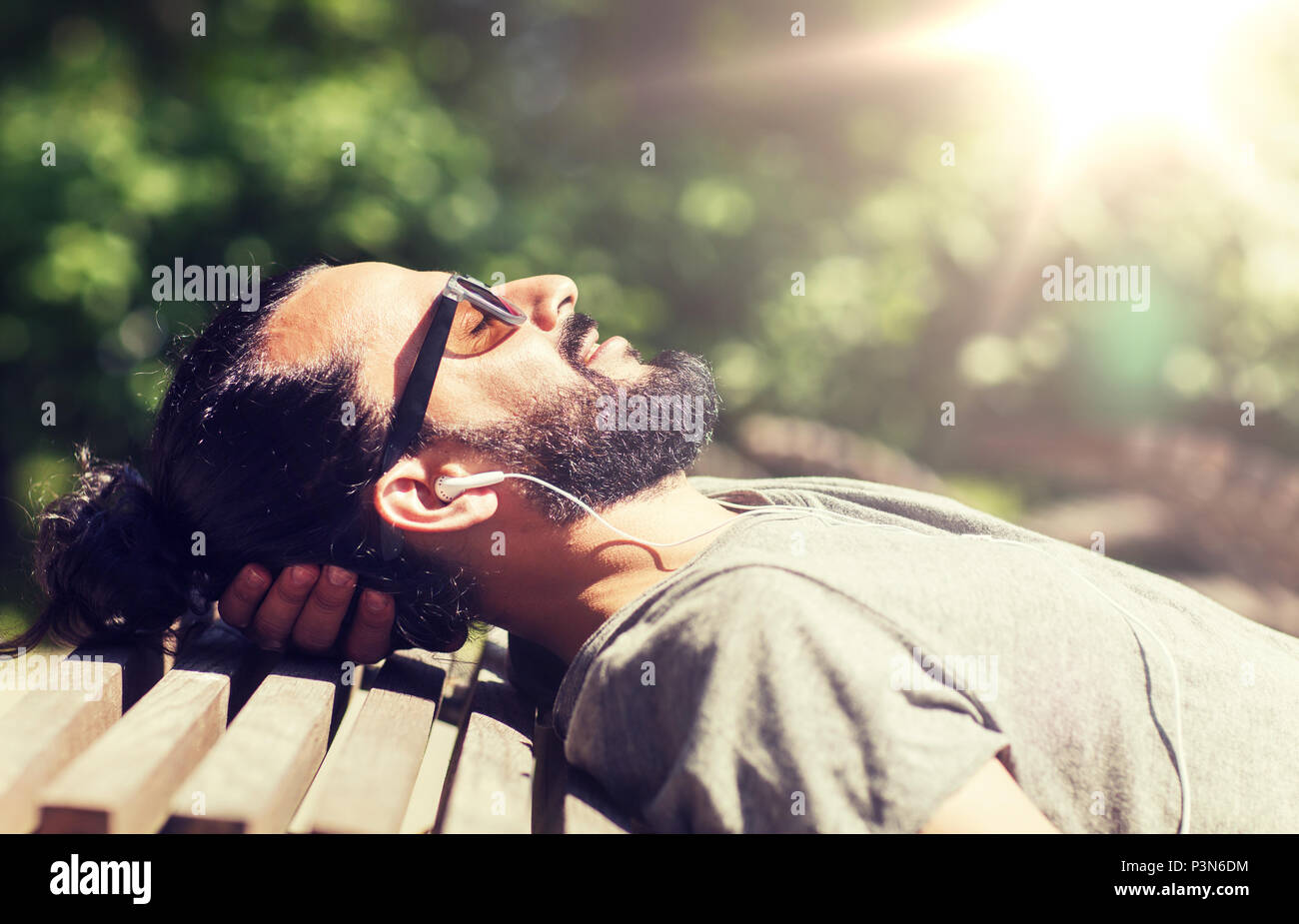 Earphones eyes closed man hi-res stock photography and images - Alamy