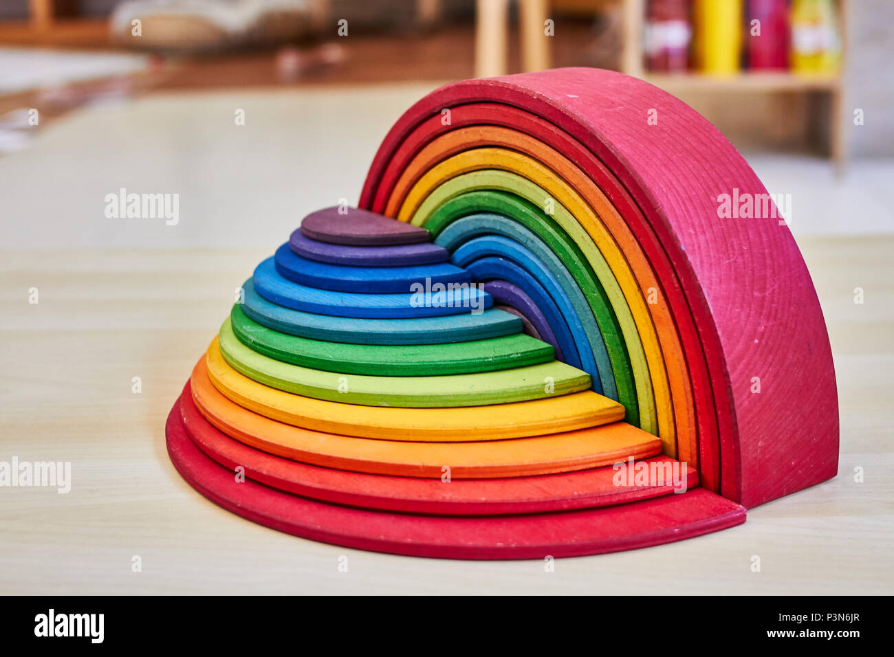 Waldorf rainbow and semicircle stack woodden puzzle Stock Photo - Alamy