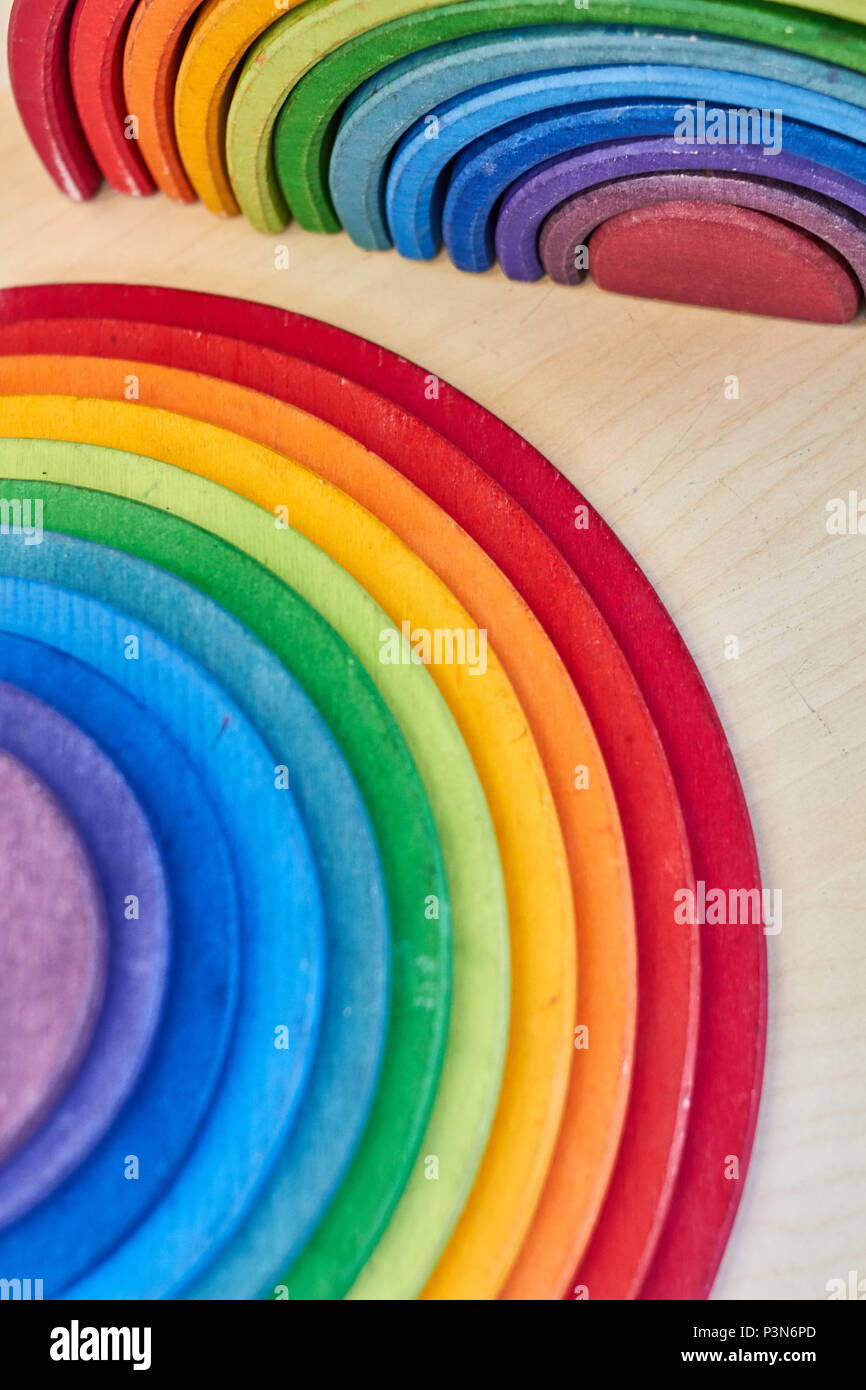 Waldorf rainbow and semicircle stack woodden puzzle Stock Photo - Alamy