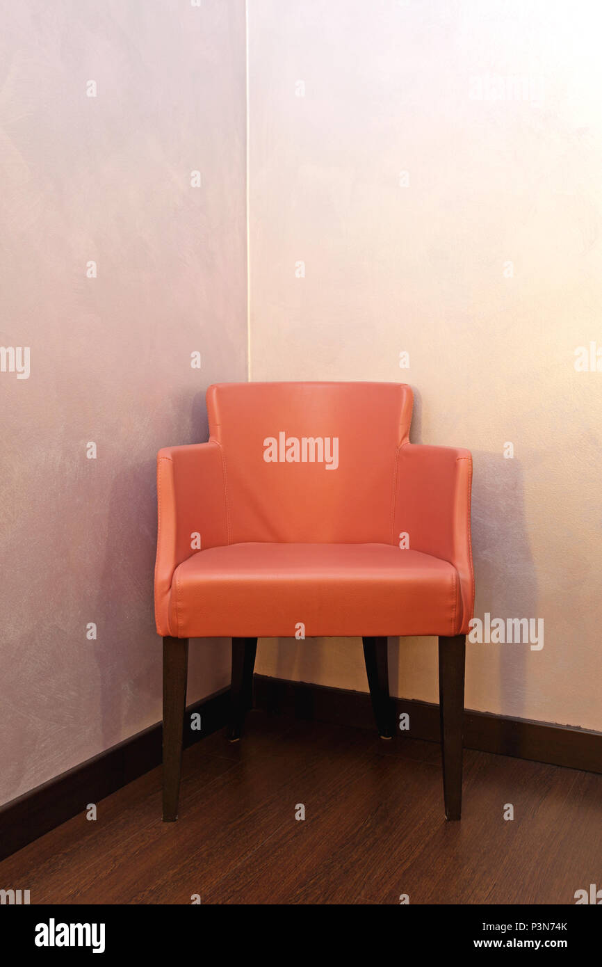 Pink Arm Chair in Modern Room Corner Stock Photo - Alamy