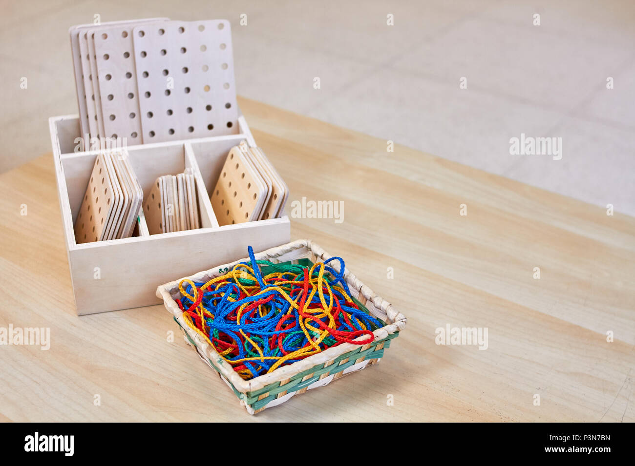 Set of colorful strings and wooden shapes for school crafts Stock Photo ...