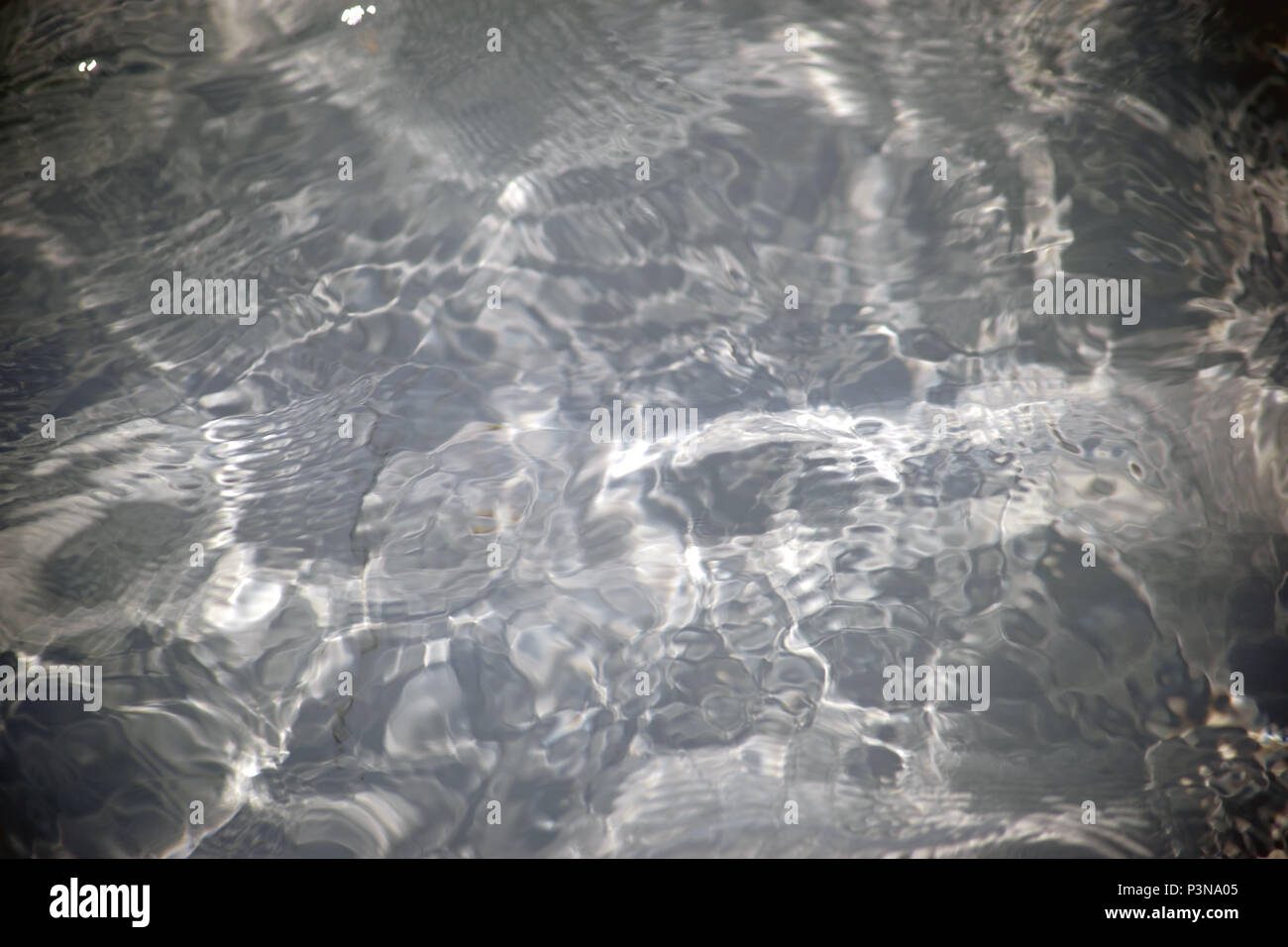 Whirl and wave patterns create abstract light reflections on the ...