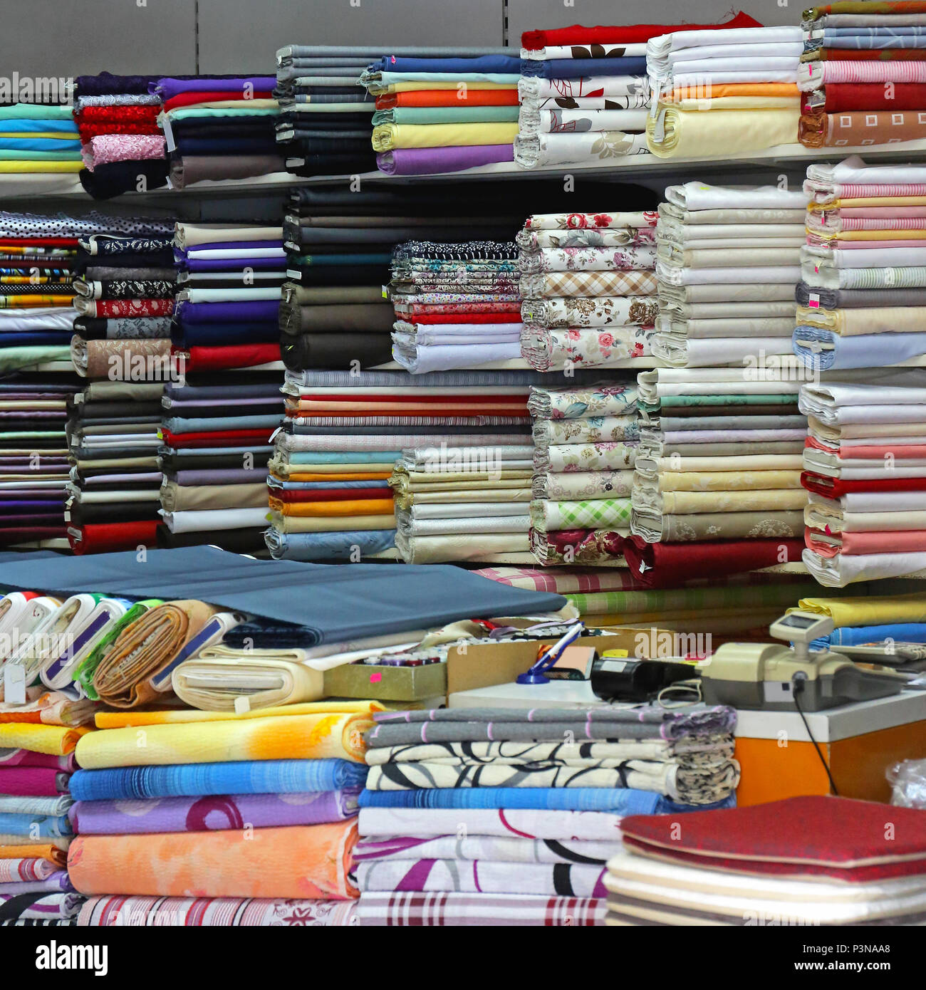 Selection of Colourful Textile Fabric Rolls at Shelf Stock Photo - Alamy