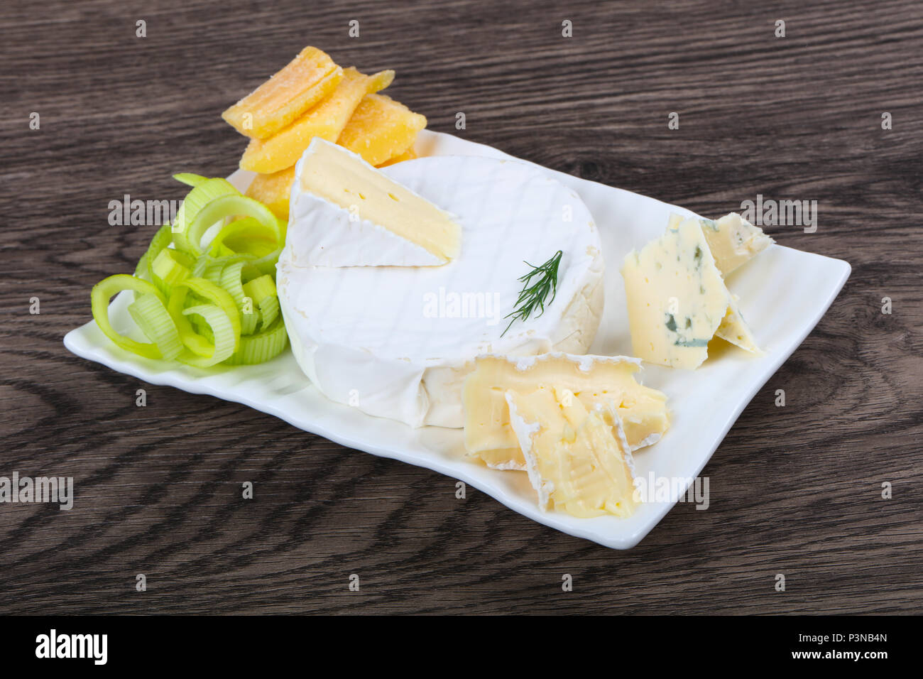 Cheese platter with brie, blue and parmesan Stock Photo - Alamy
