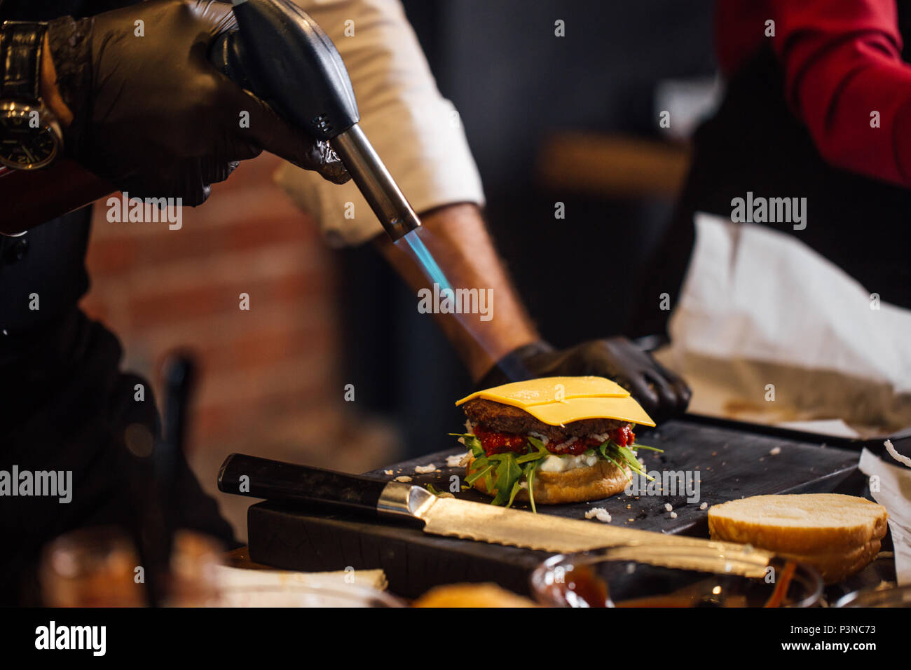 Chef making beef burgers at burger pub Stock Photo - Alamy