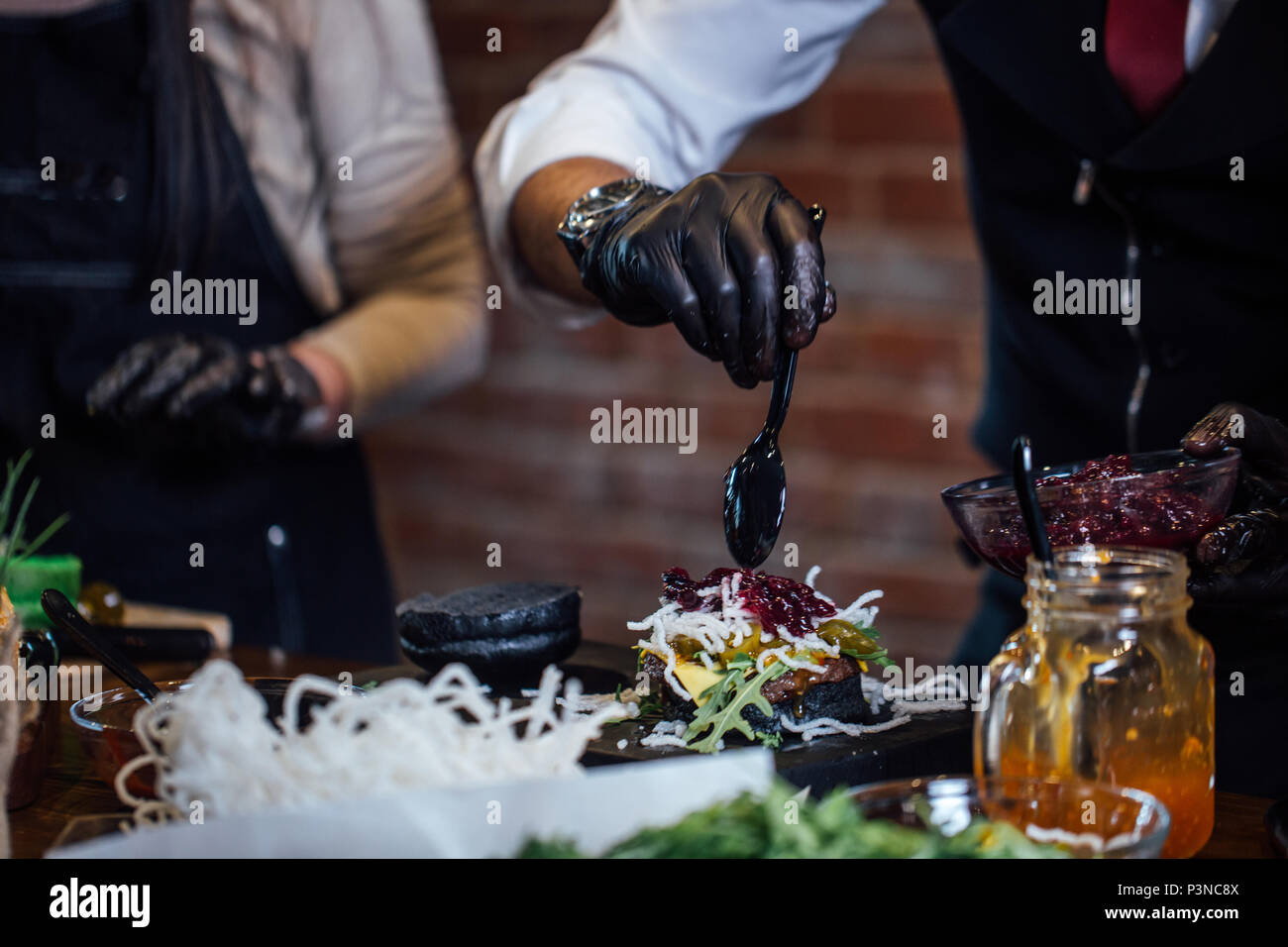 Burger making process hi-res stock photography and images - Alamy