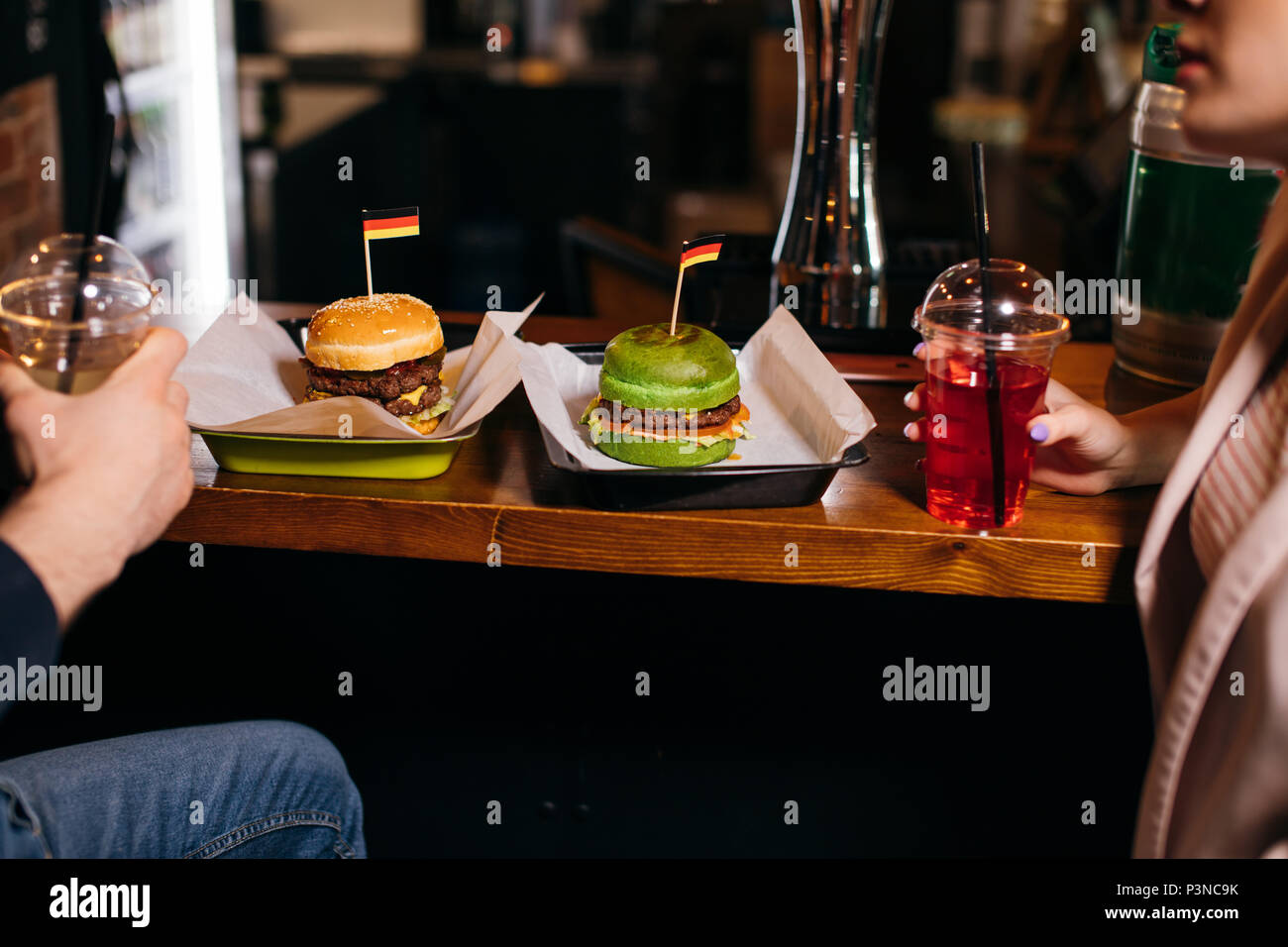 Young people eating burgers hi-res stock photography and images - Alamy