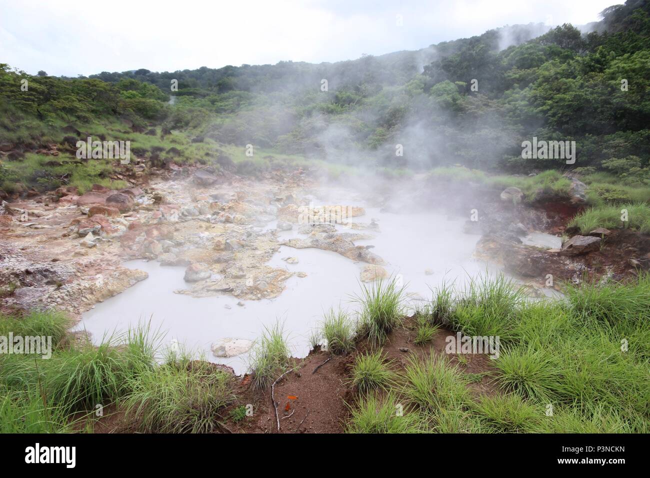Smoke rising from a mud pit near a volcano Stock Photo - Alamy