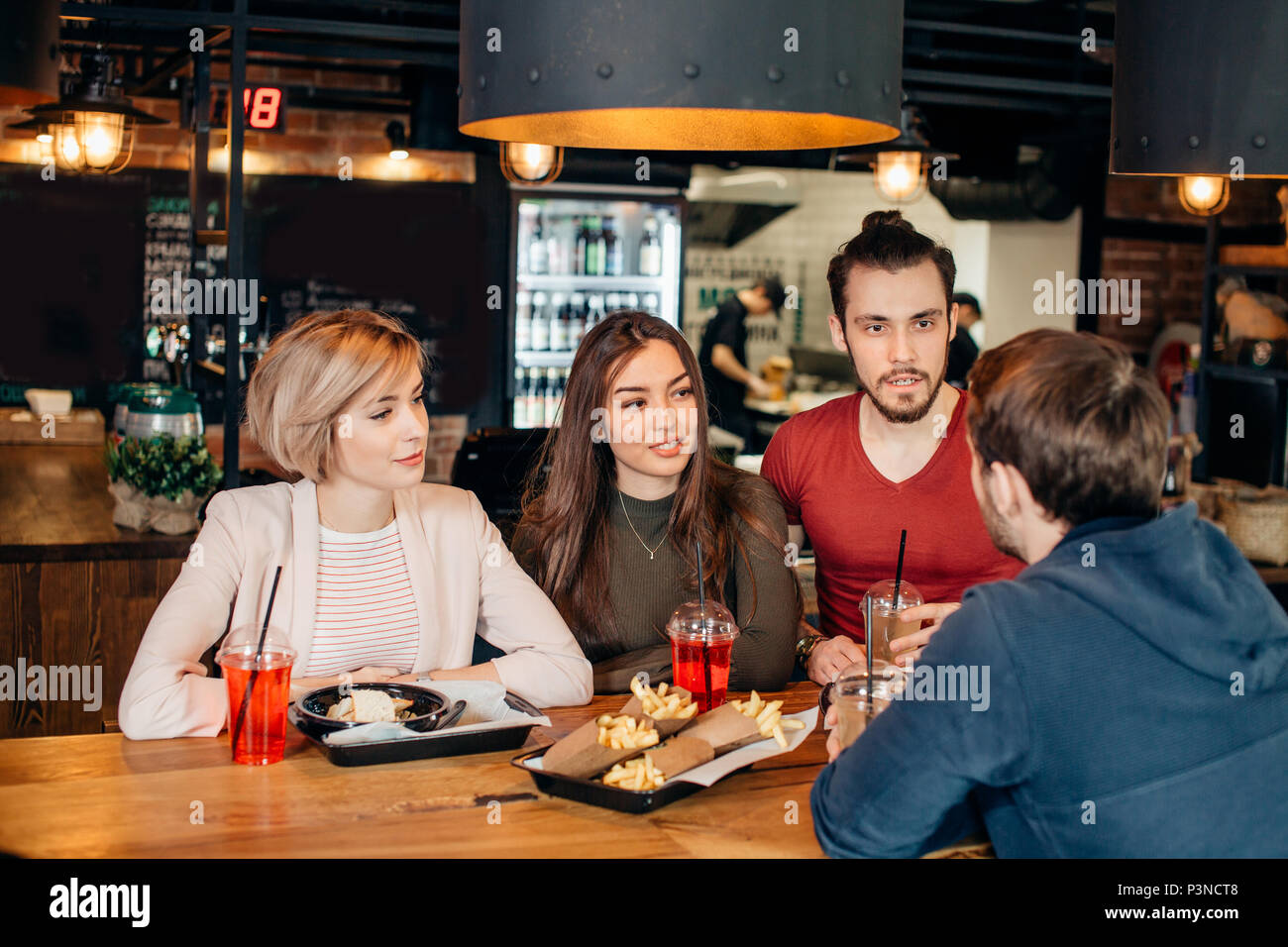 Eating outside female male friends hi-res stock photography and images ...