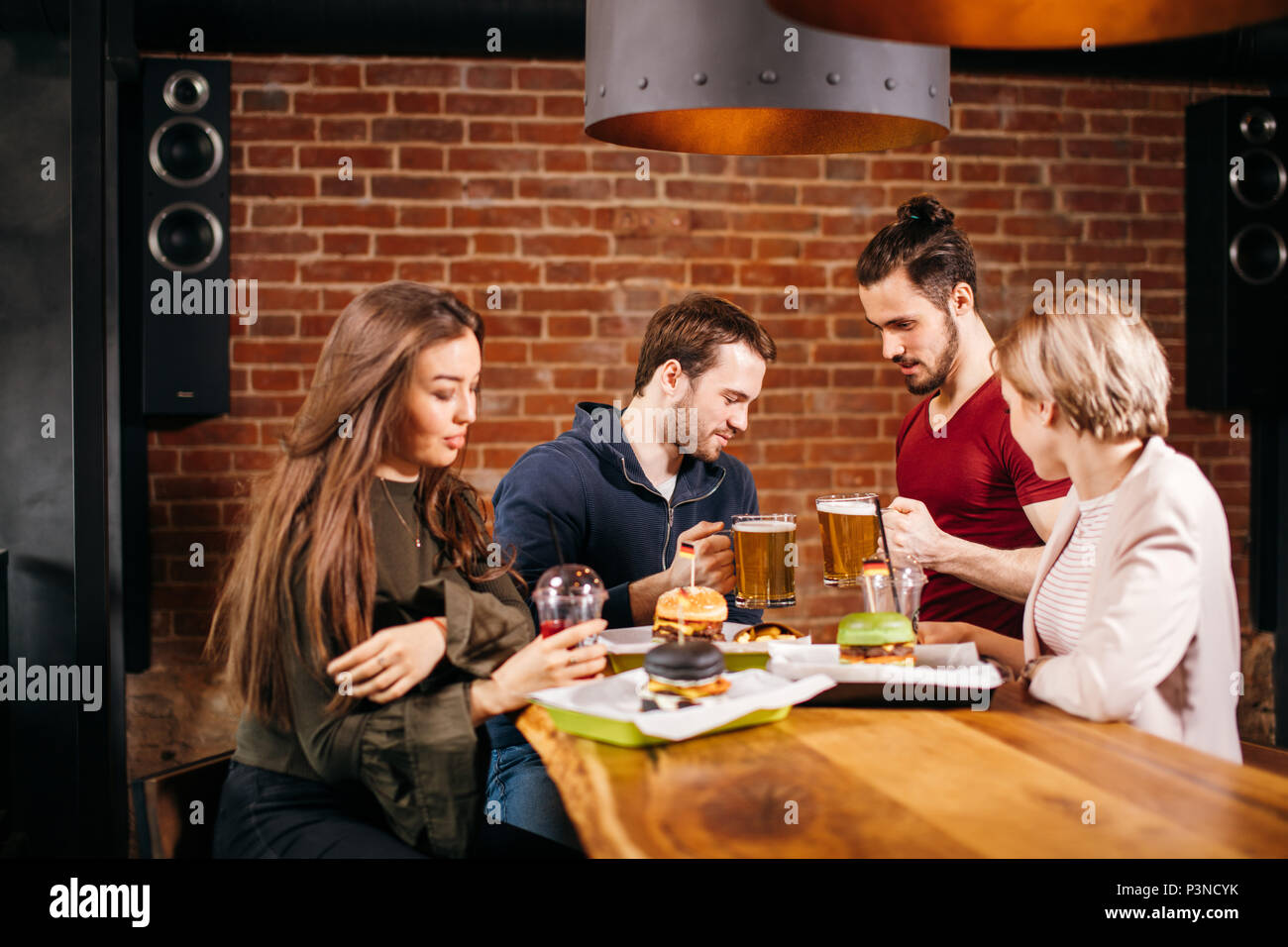 Four diverse students making a toast celebrating graduation Stock Photo ...