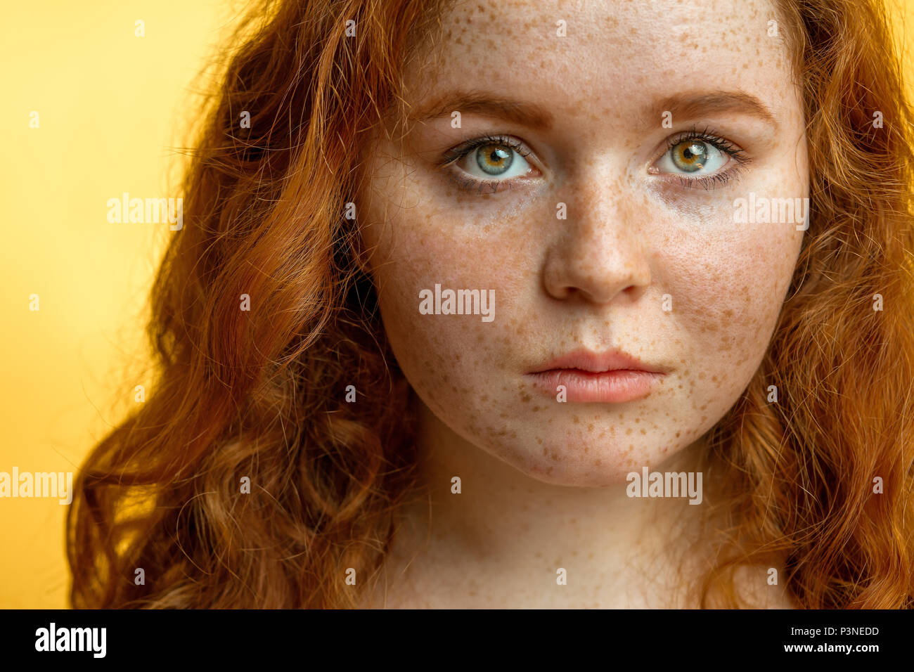 Close Up Of Beautiful Red Haired Freckled Girl With Loose Curly Hair
