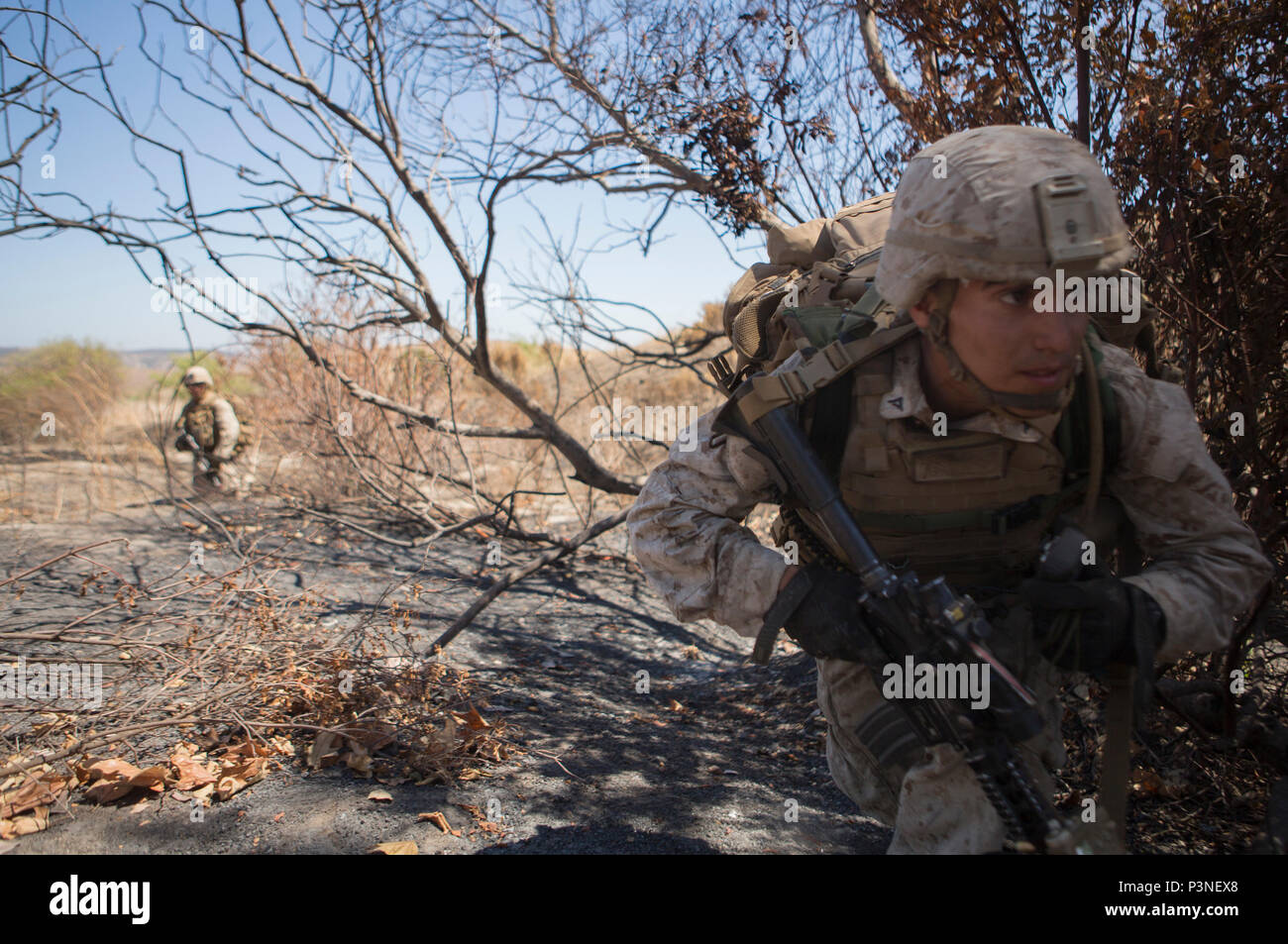 Lance Cpl. Jaime J. Camacho prepares to buddy rush with his team during ...