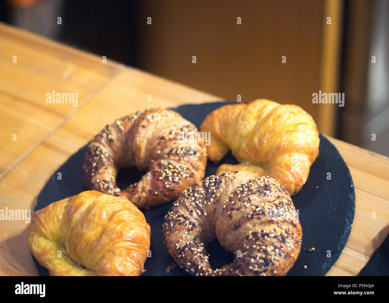 Freshly baked croissants in bakery bread shop on sale in the store ...