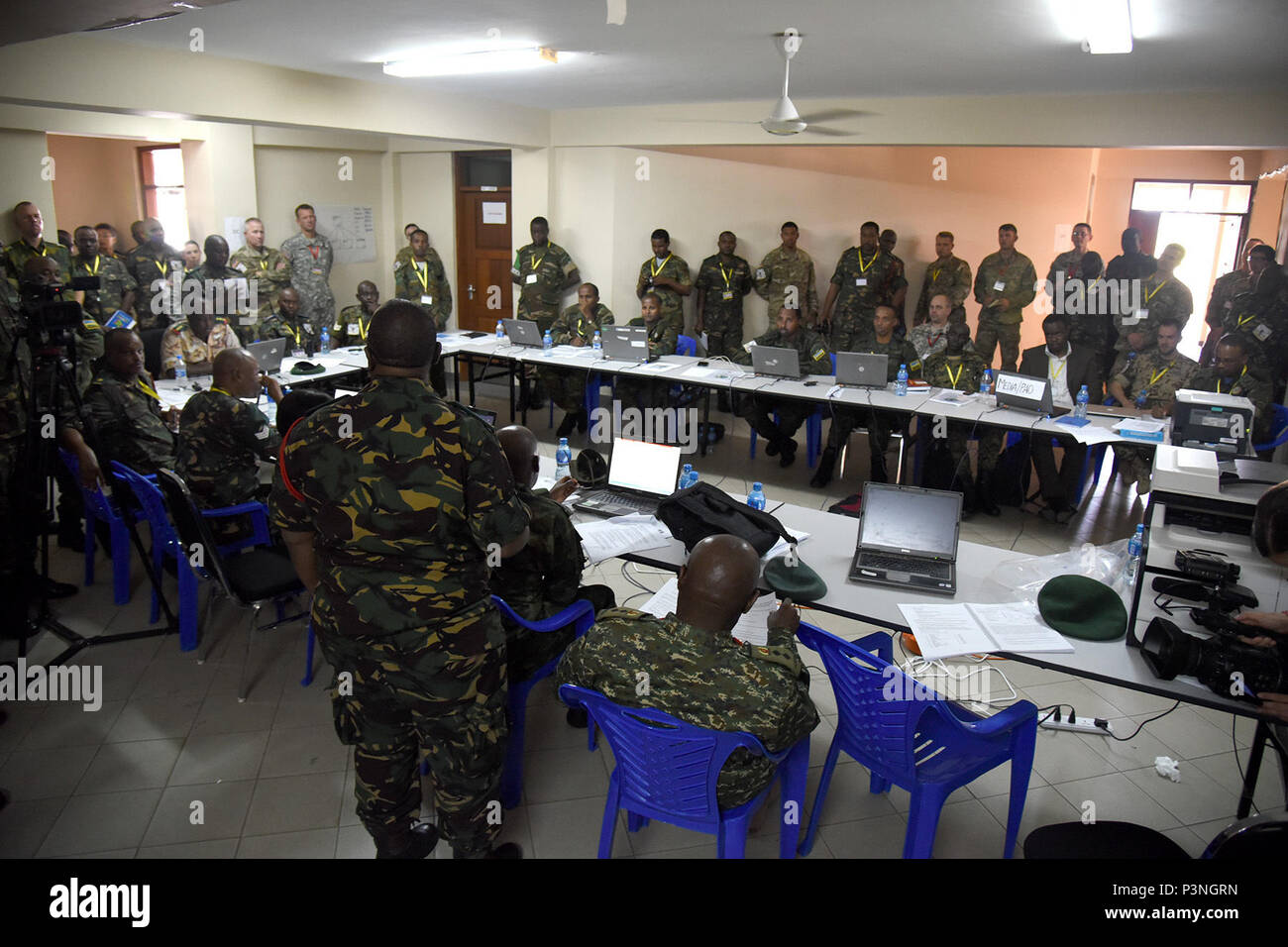 Observer controllers and trainers complete a practice inject in the ...