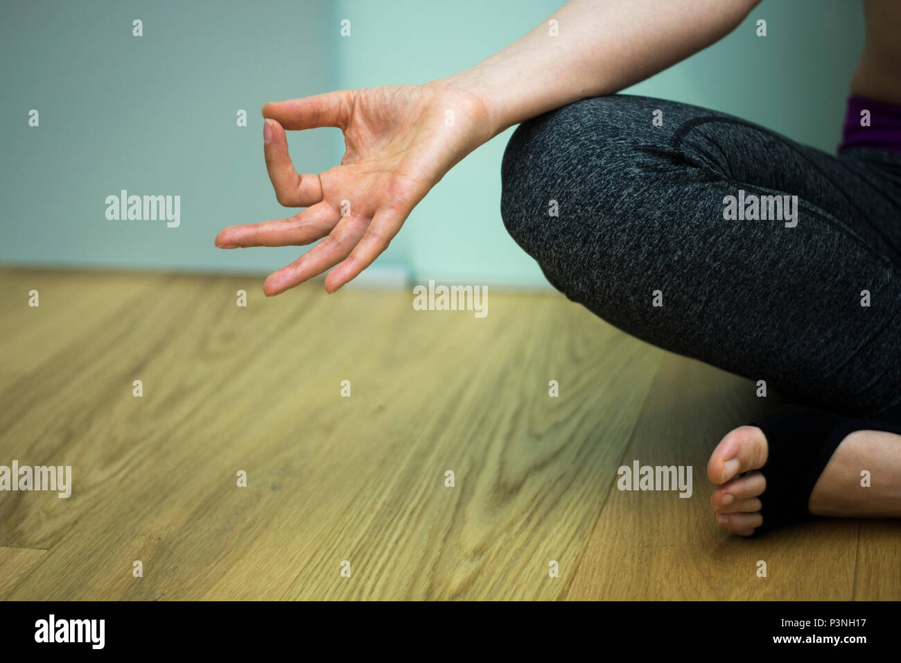 Female instructor yoga teacher teaching asana pose with mudra hand ...