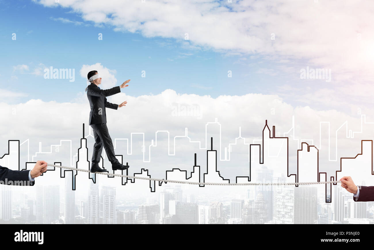 Business concept of risk support and assistance with man balancing on ...