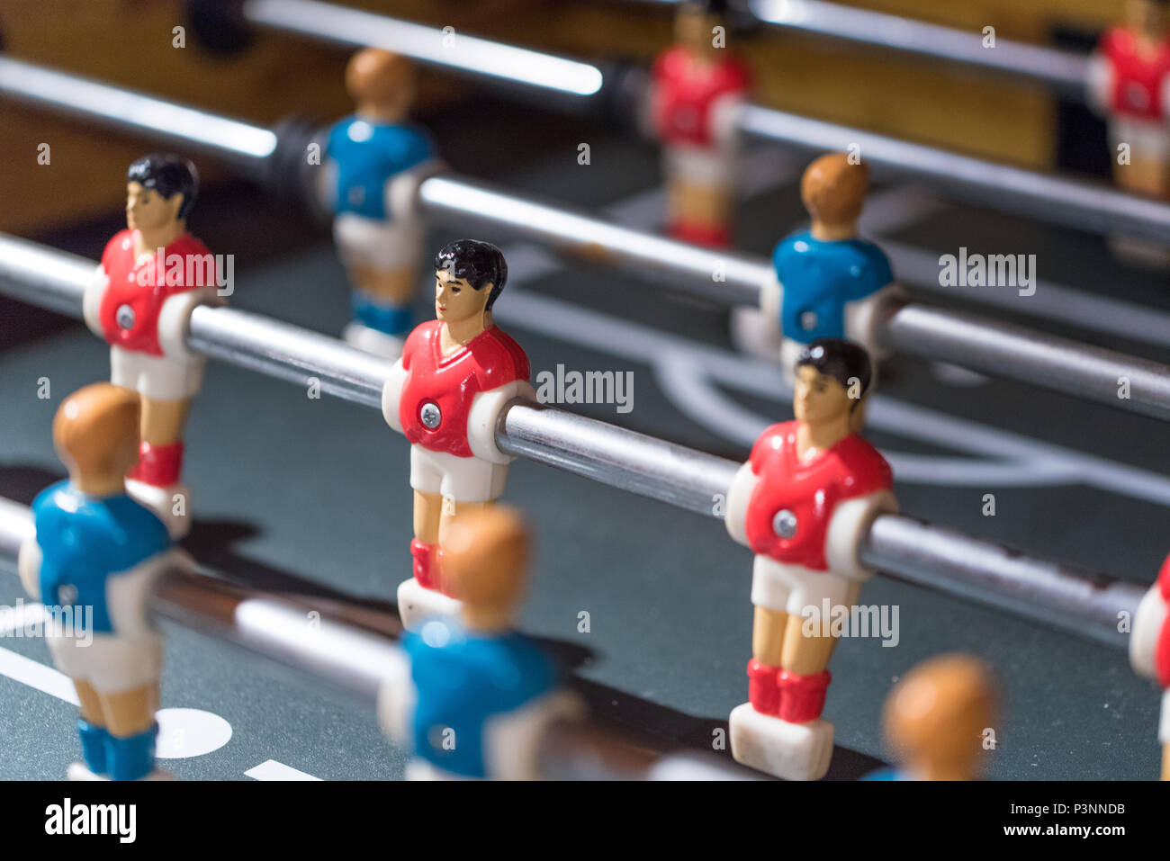 Table football kicker with miniature players Stock Photo - Alamy