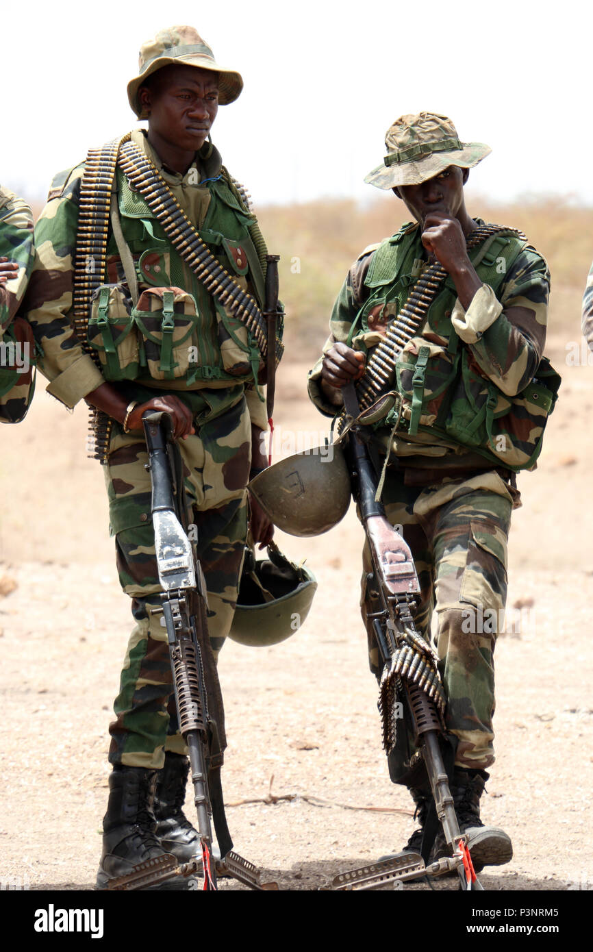 Senegalese soldiers with the 1st Paratrooper Battalion listen to an ...