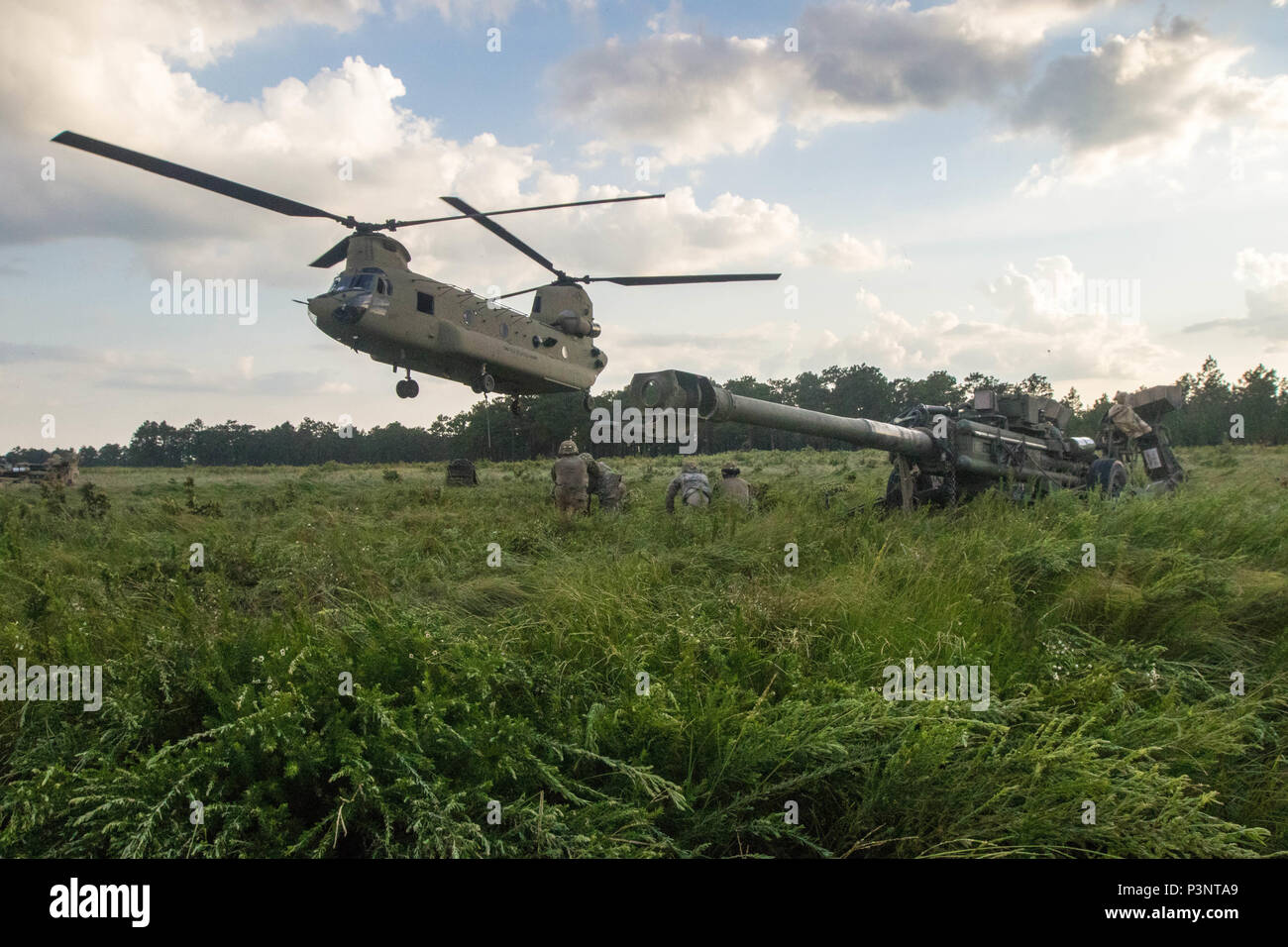 Paratroopers assigned to the 82nd Airborne Division Artillery brace ...