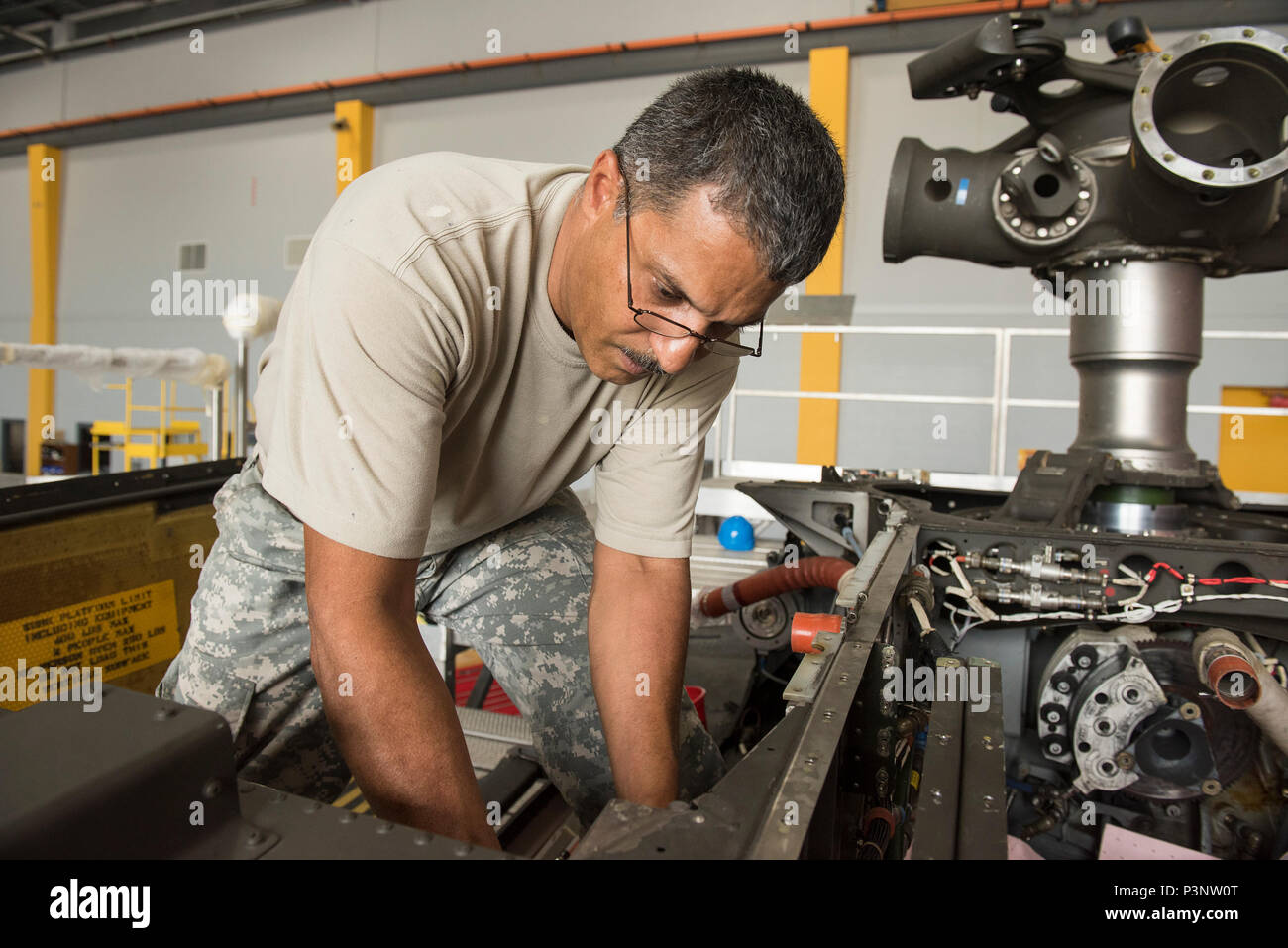 U.S. Army Sgt. Julio Rivera, a Black Hawk mechanic with Charlie Company ...