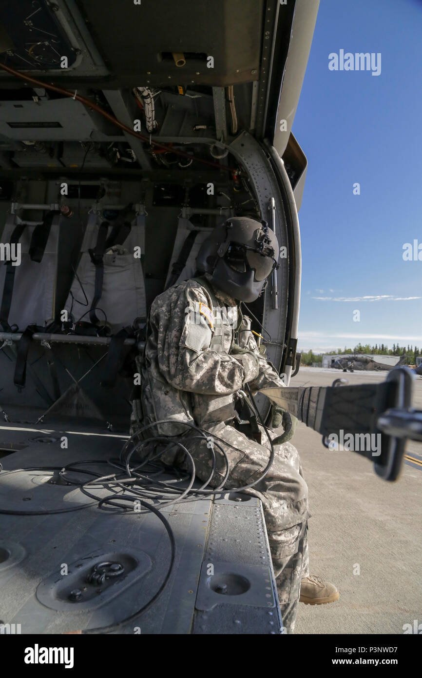 Sgt. Adam Weber, a crew chief with A Co., 1st Battalion, 207th Aviation ...