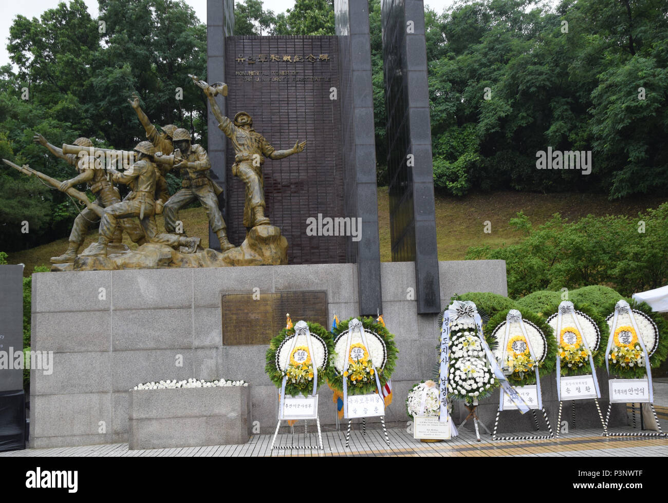 The Task Force Smith Monument is surrounded by wreaths and white ...