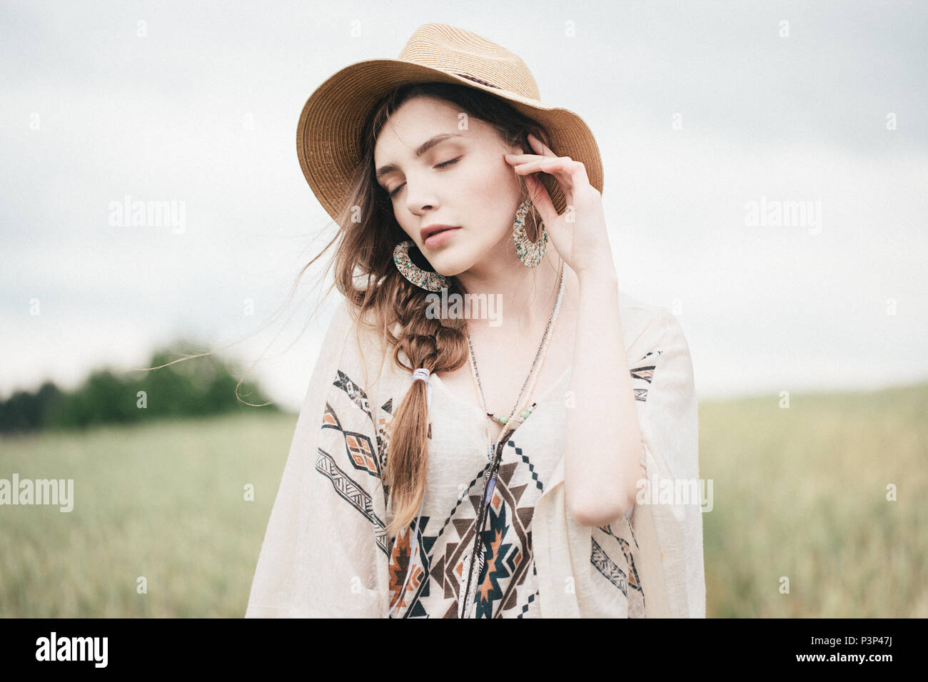 Girl in eco style clothes posing in nature background. Portrait of ...