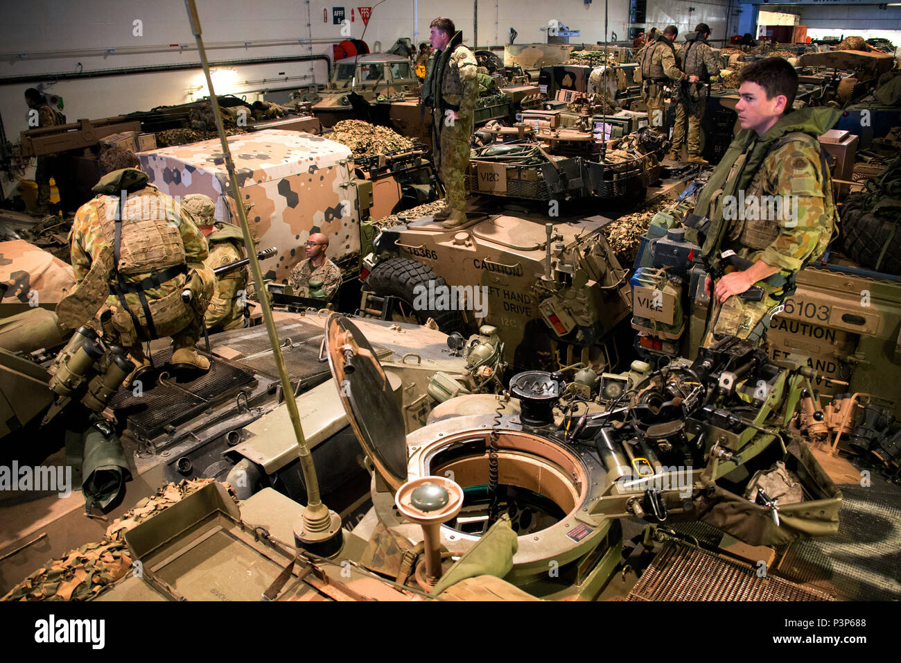 Australian Army soldiers prepare their vehicles for disembarkation from ...