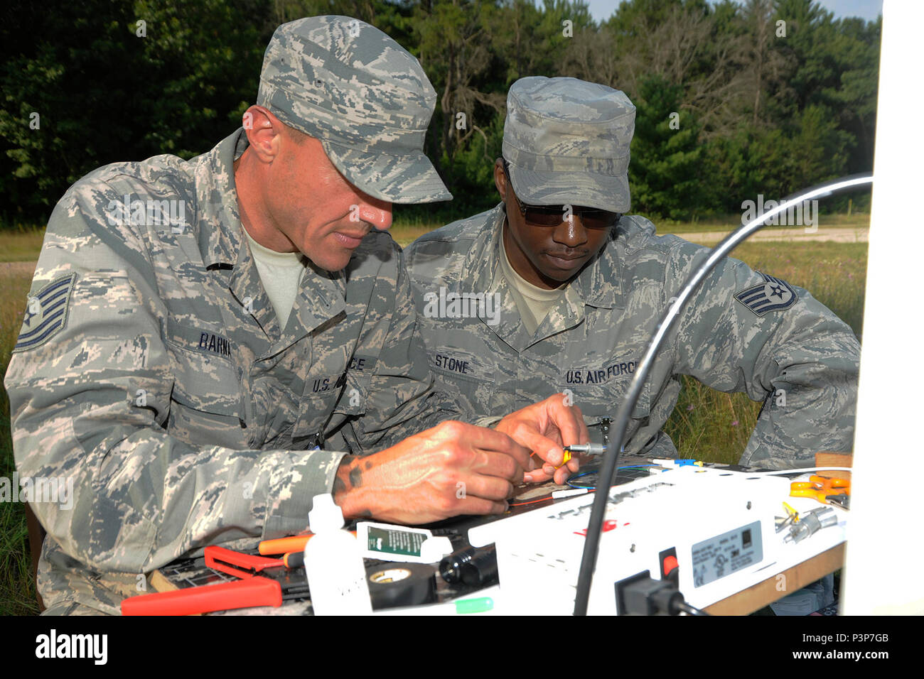 Tech. Sgt. Jeff Barna, left, and Staff Sgt., Jovann Stone both of the ...
