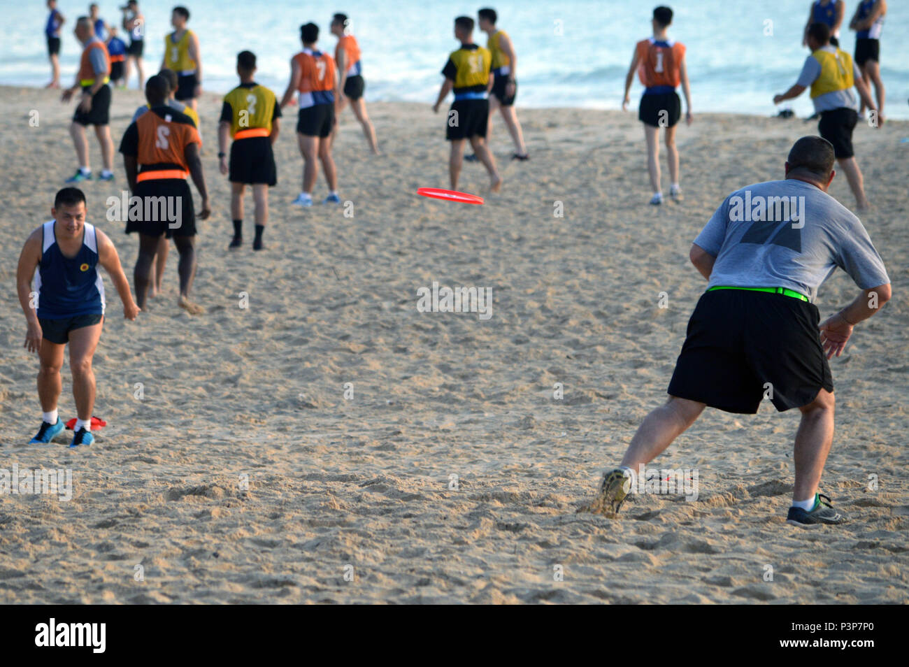 Soldiers from the U.S. Army and Singapore Armed Forces play with a ...