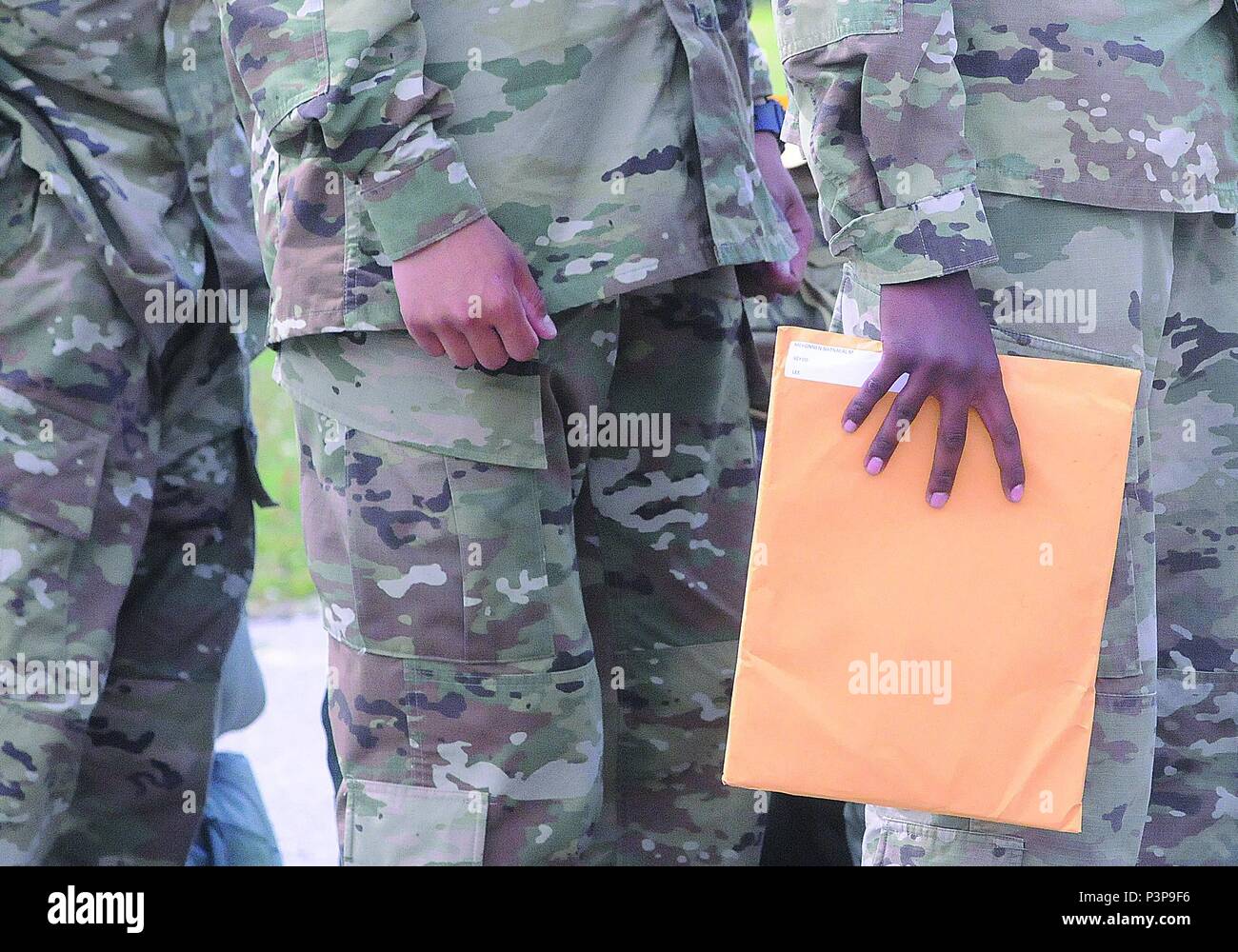 Soldiers -- some holding envelopes with important documents -- stand in ...