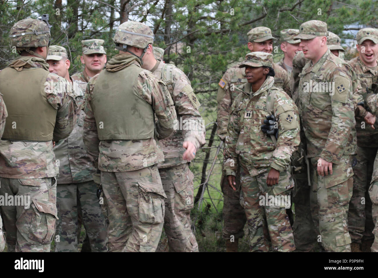 A tank platoon from 1st Battalion, 66th Armor Regiment, is cheered on ...