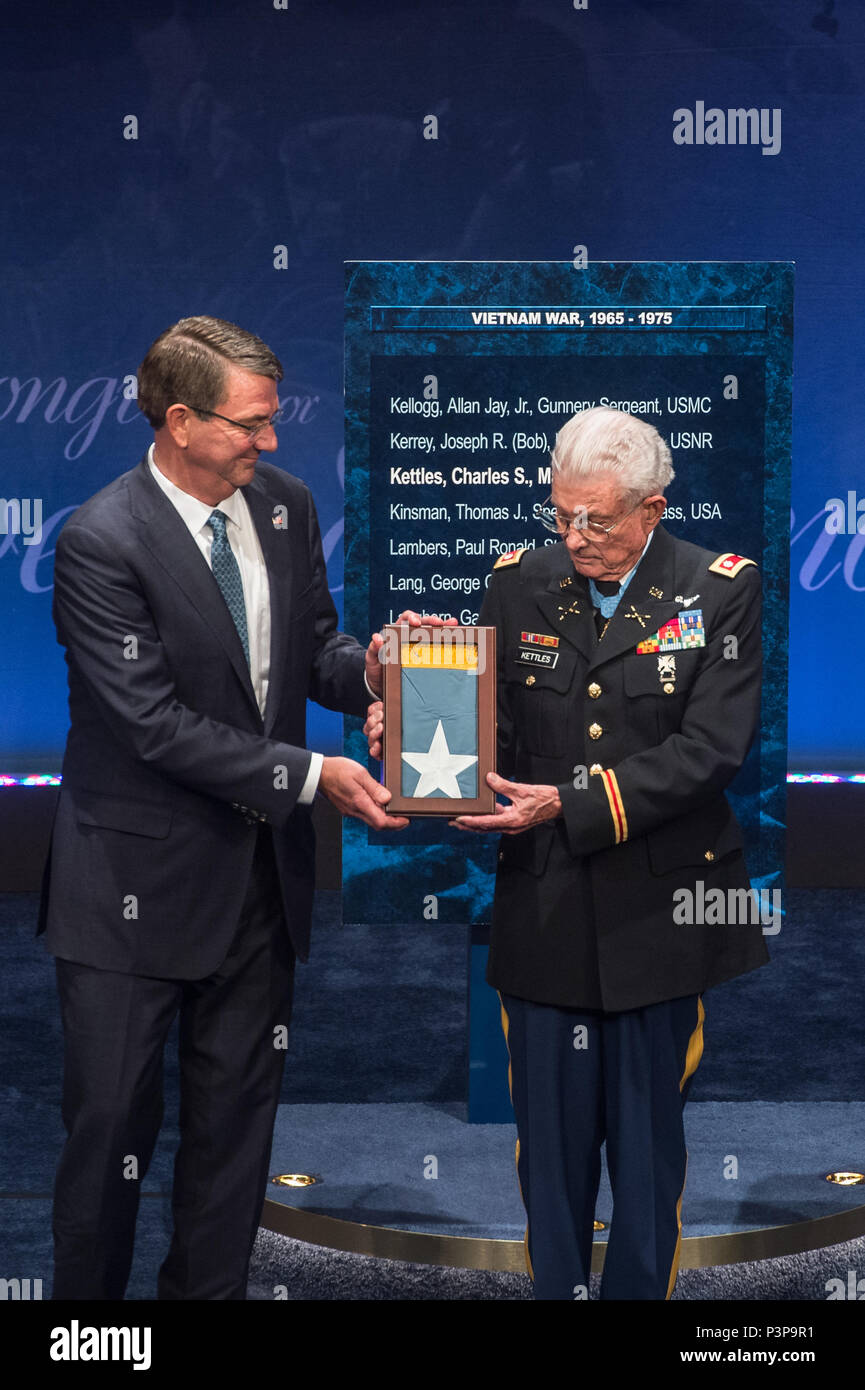 Secretary of Defense Ashton B. Carter, left, presents the Medal of ...