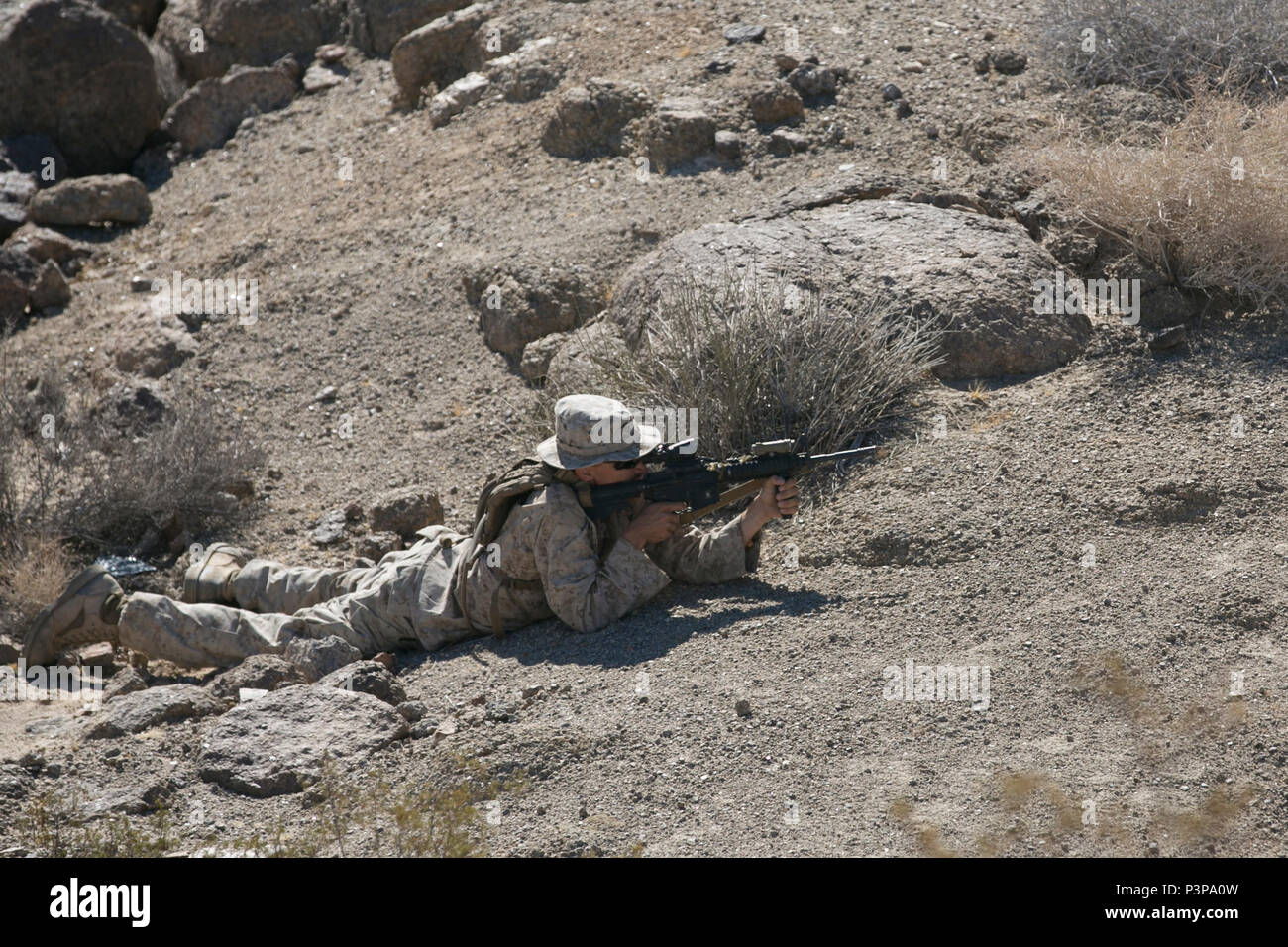 A Marine team leader conducts marksmanship and sighting exercises ...