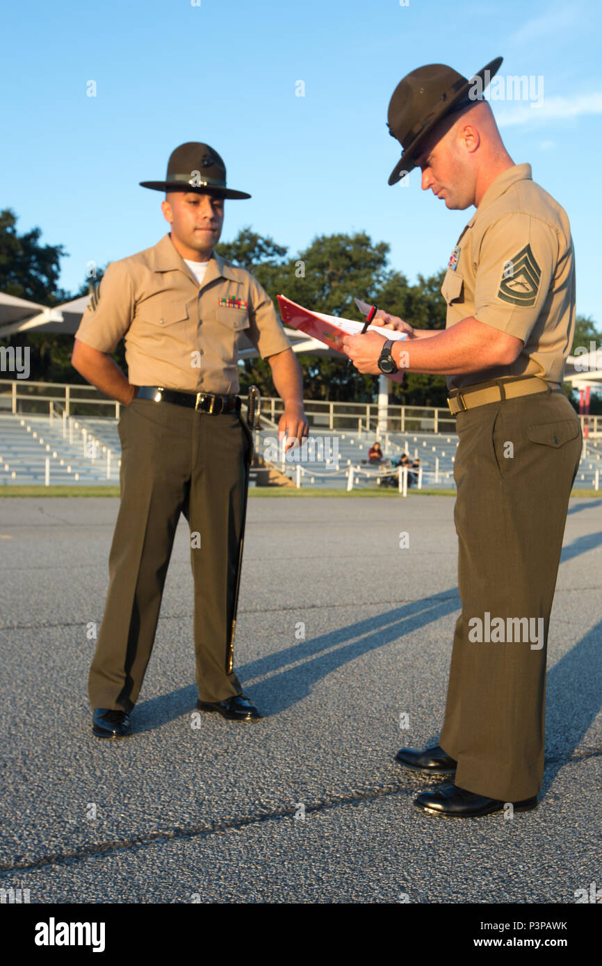 Gunnery Sgt. Zane E. Moorman, a Parris Island drillmaster, inspects Sgt ...