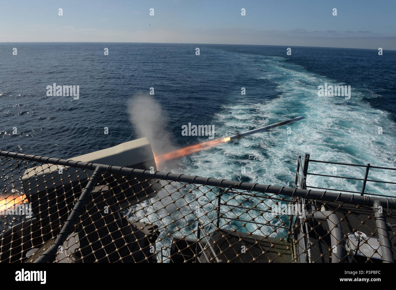 A Rolling Airframe Missile (RAM) is launched from the aft launcher of ...
