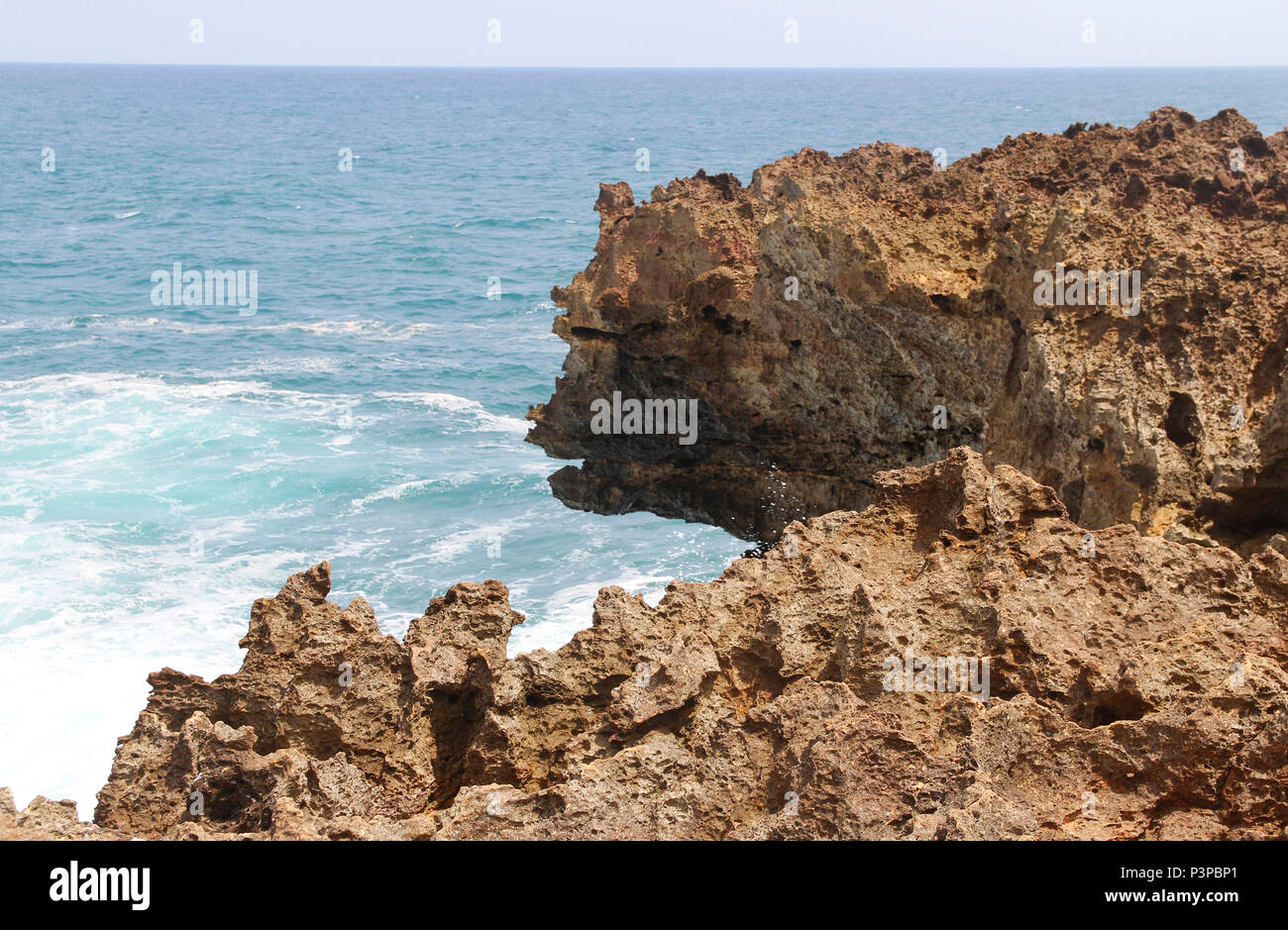 Natural rock formation with the wave at Timang Beach in sunny day ...