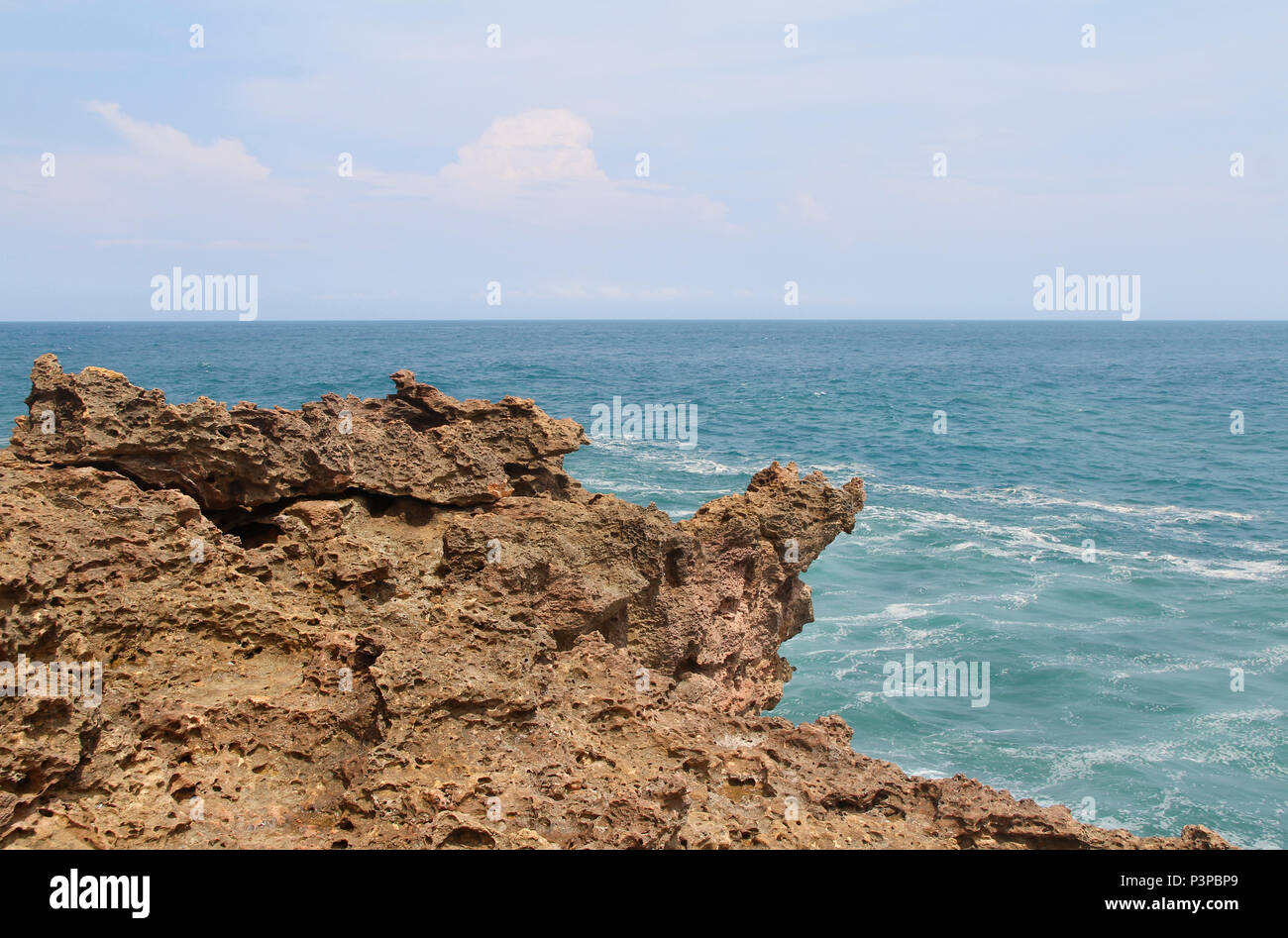 Natural rock formation with the wave at Timang Beach in sunny day ...