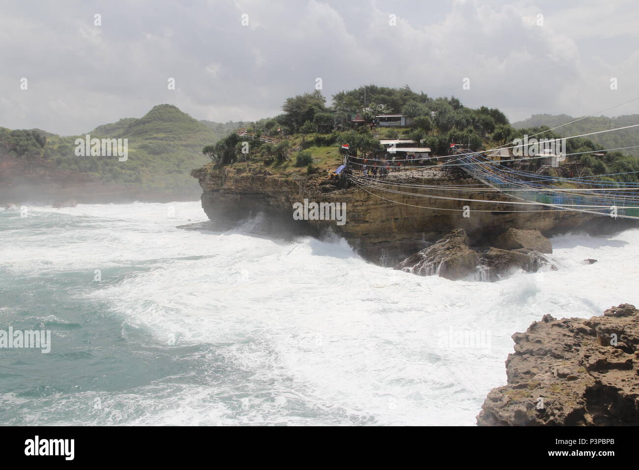 Suspension bridge connecting to the Timang Beach in sunny day ...